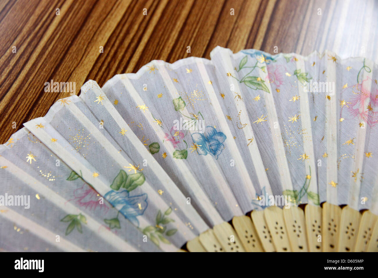 A Chinese fan flower pattern pink color Stock Photo - Alamy
