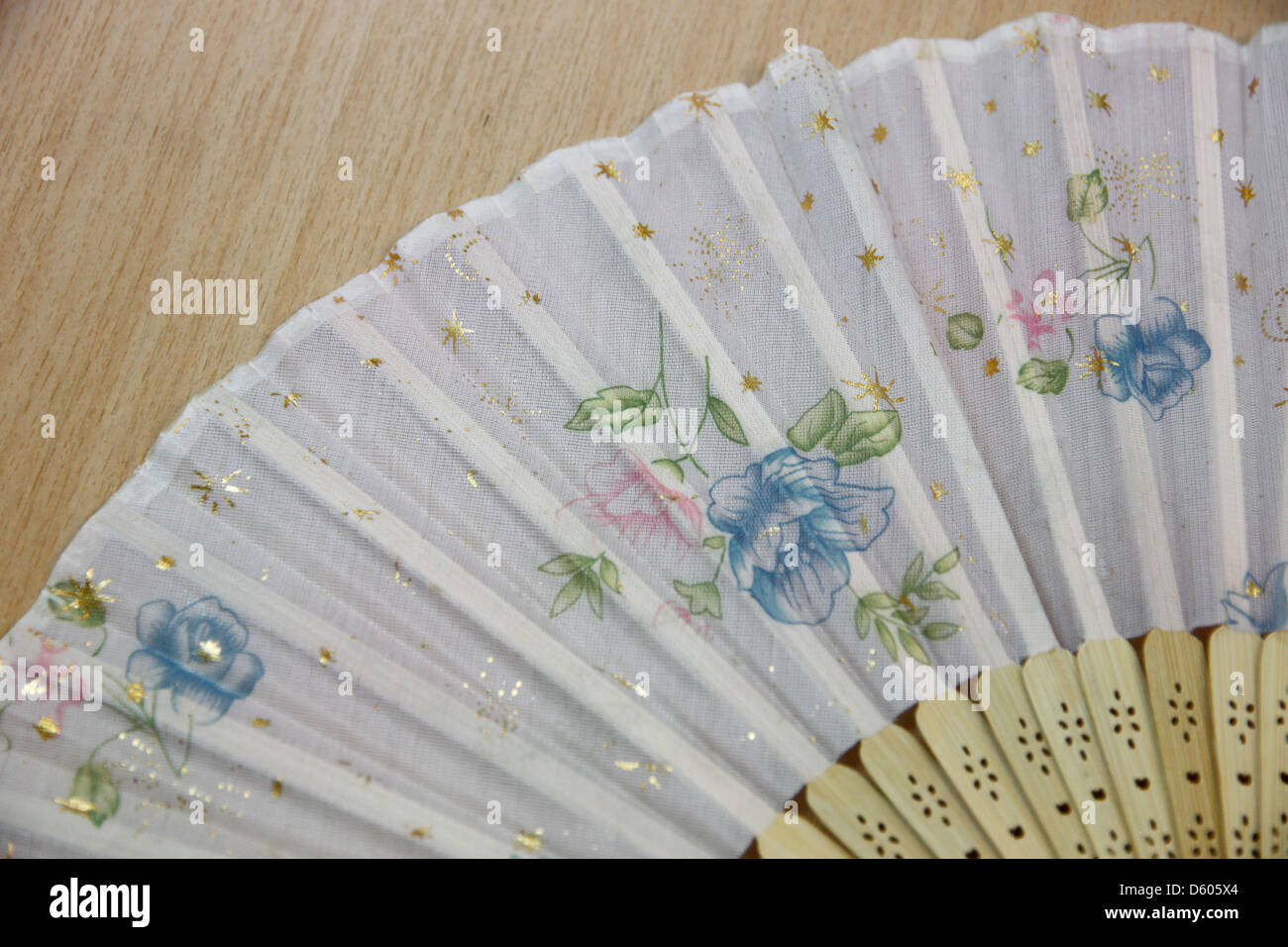 A Chinese fan flower pattern pink color Stock Photo - Alamy