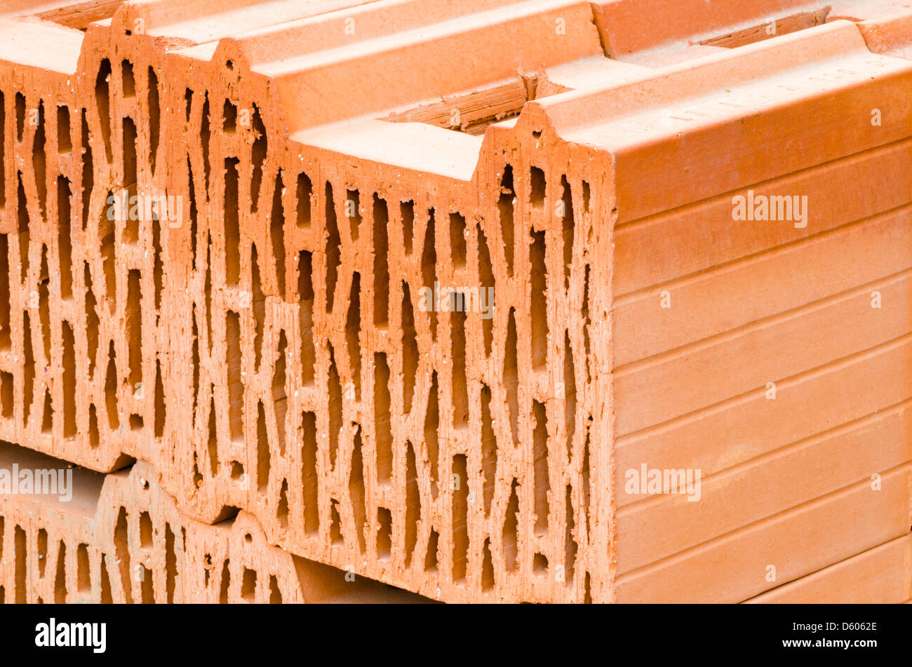 Stack of clay bricks in a warehouse Stock Photo - Alamy