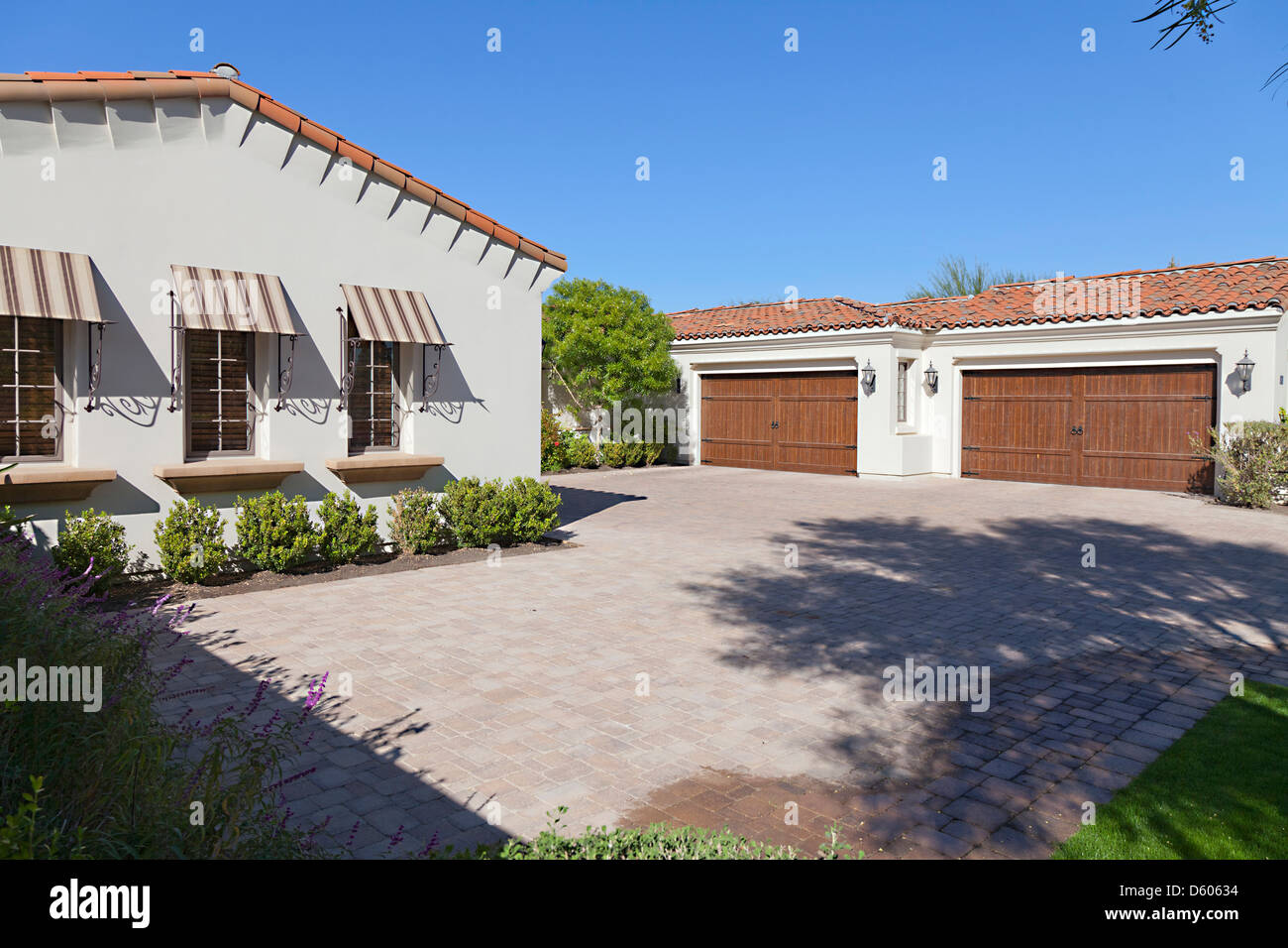 Driveway with twin double garage Stock Photo - Alamy