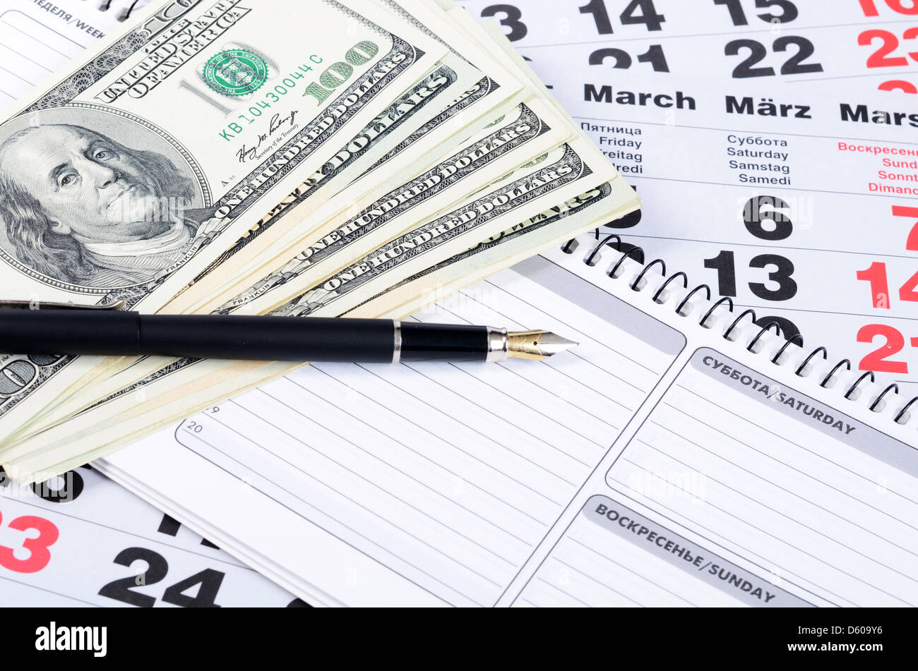 Banknotes of dollars on calendar sheets Stock Photo - Alamy