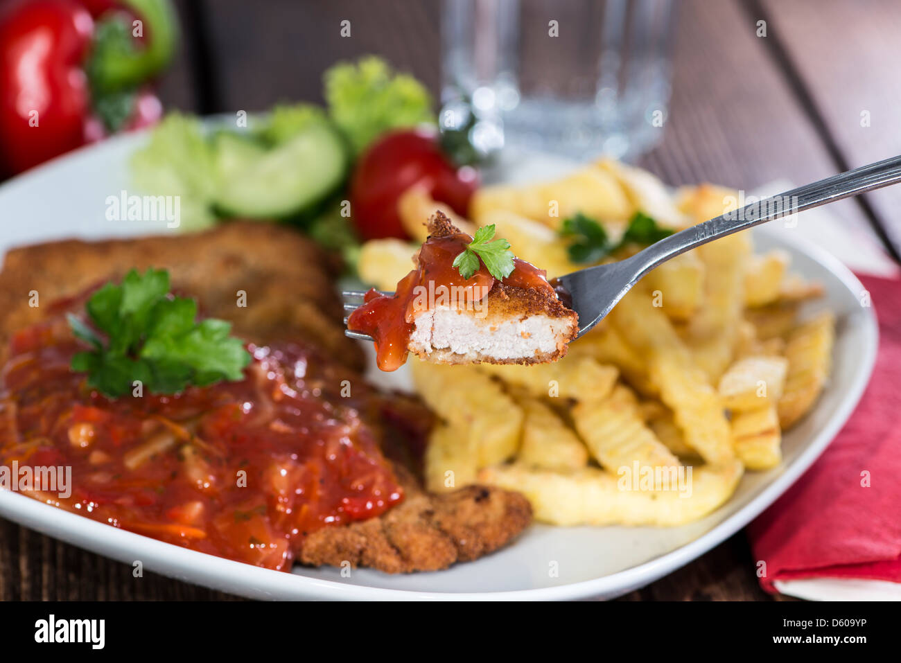 Fresh made Schnitzel with Sauce and Chips Stock Photo - Alamy