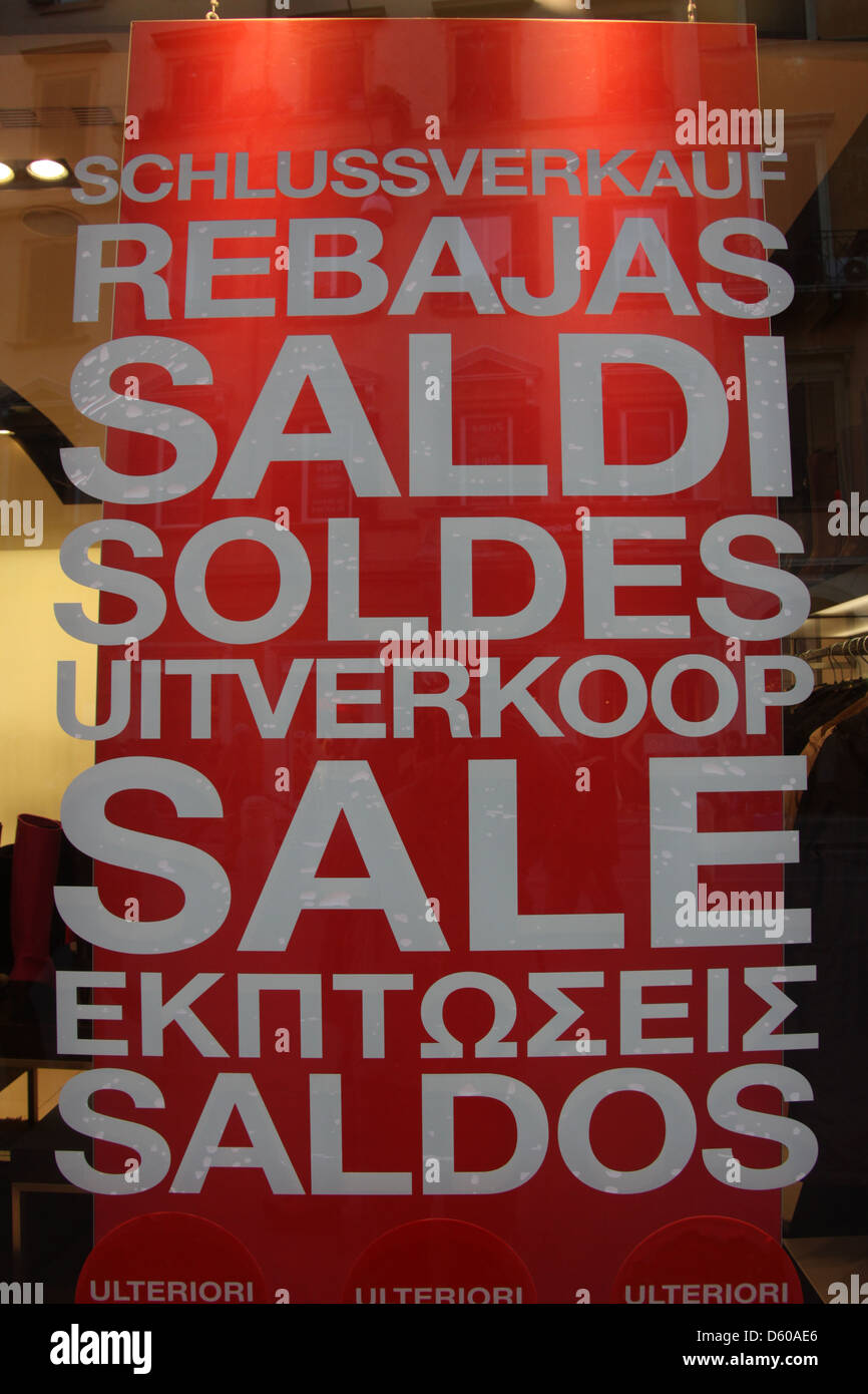 multilingual sales sign in shop window in rome italy Stock Photo - Alamy