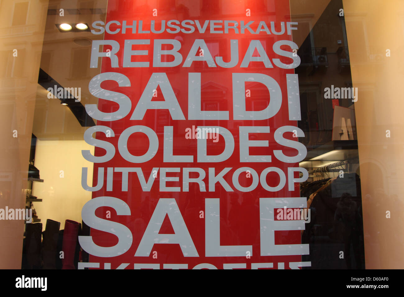 multilingual sales sign in shop window in rome italy Stock Photo - Alamy