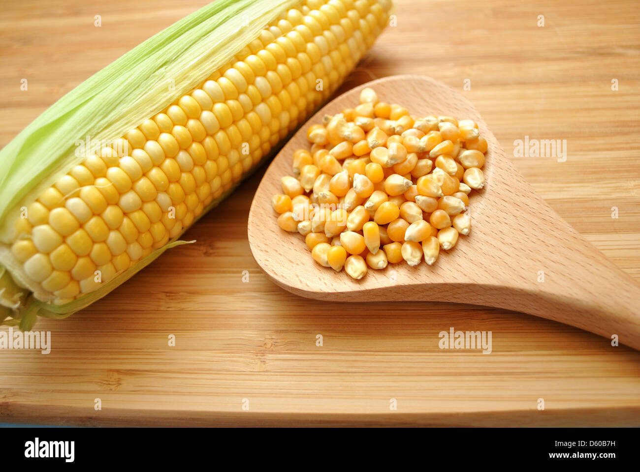 Golden Corn Kernels with a Whole Ear of Corn Stock Photo - Alamy