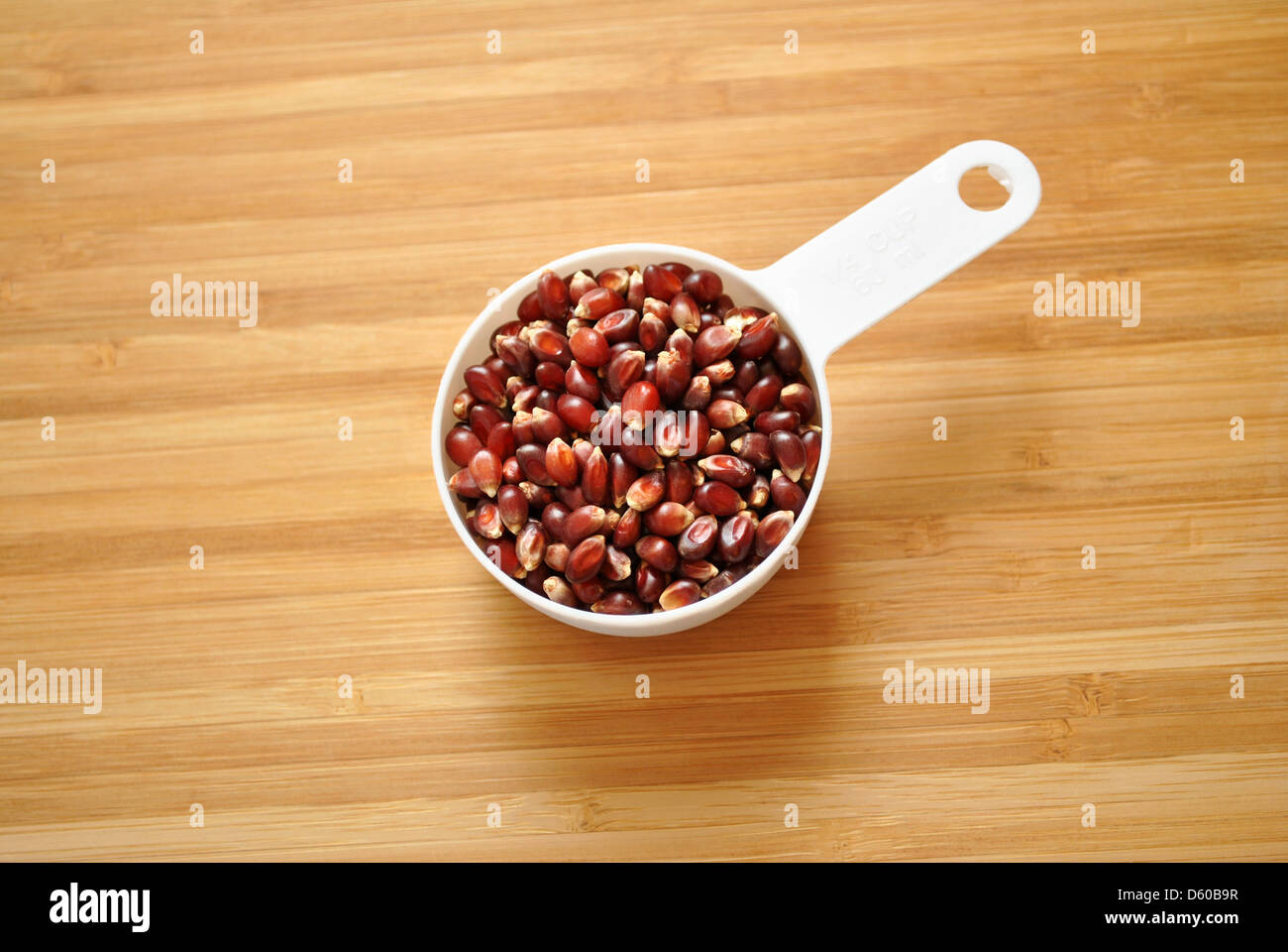 Red Popcorn Kernels Stock Photo - Alamy