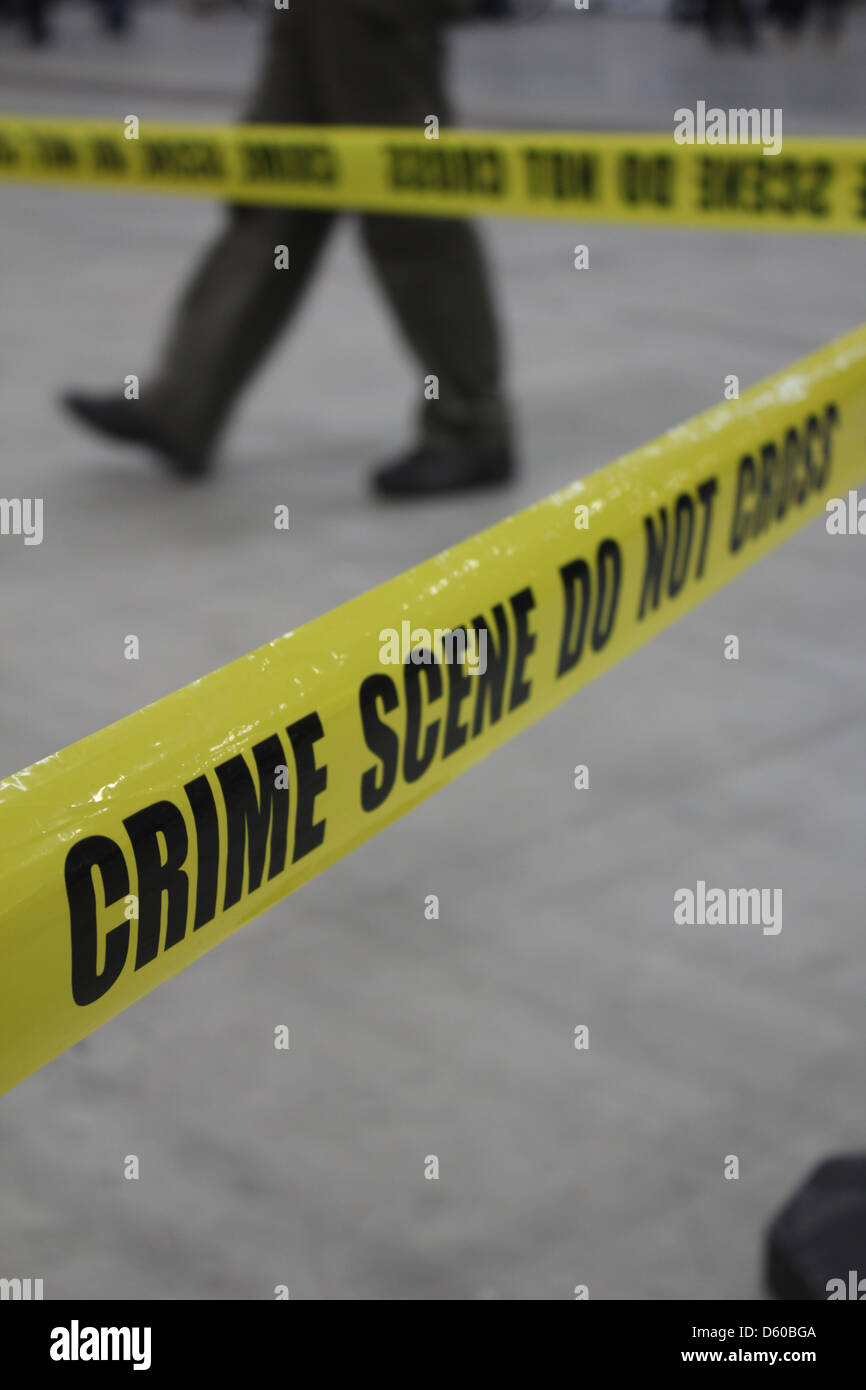 crime scene tape by exhibit in conference centre Stock Photo - Alamy
