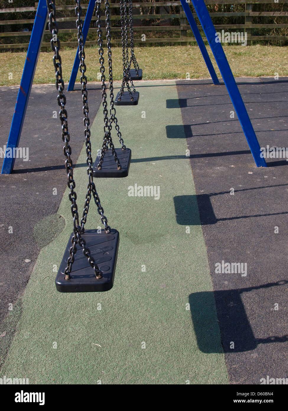 Public park playground swings hi-res stock photography and images - Alamy