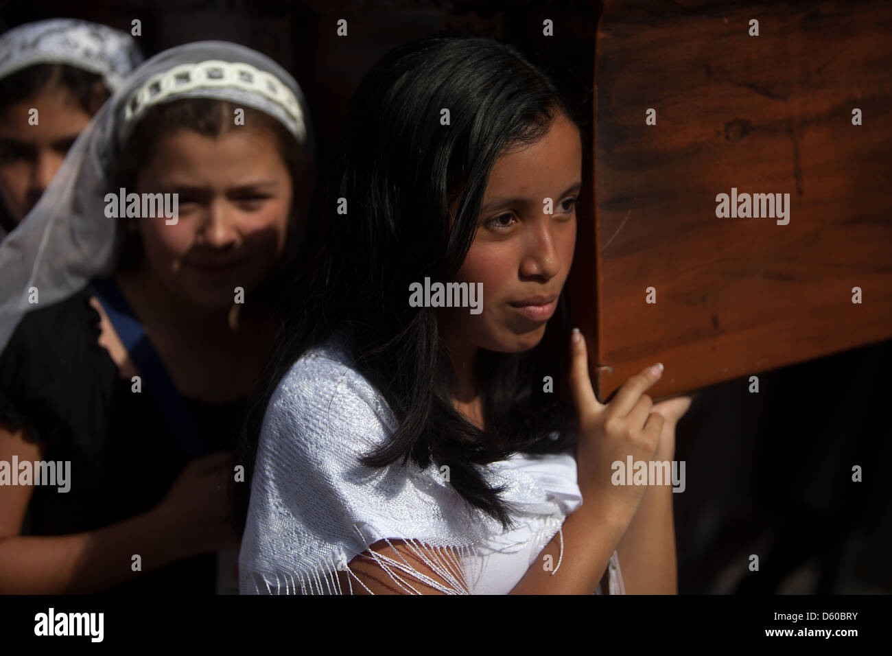 A girl carries a throne on her shoulder during La Merced's Easter Holy ...