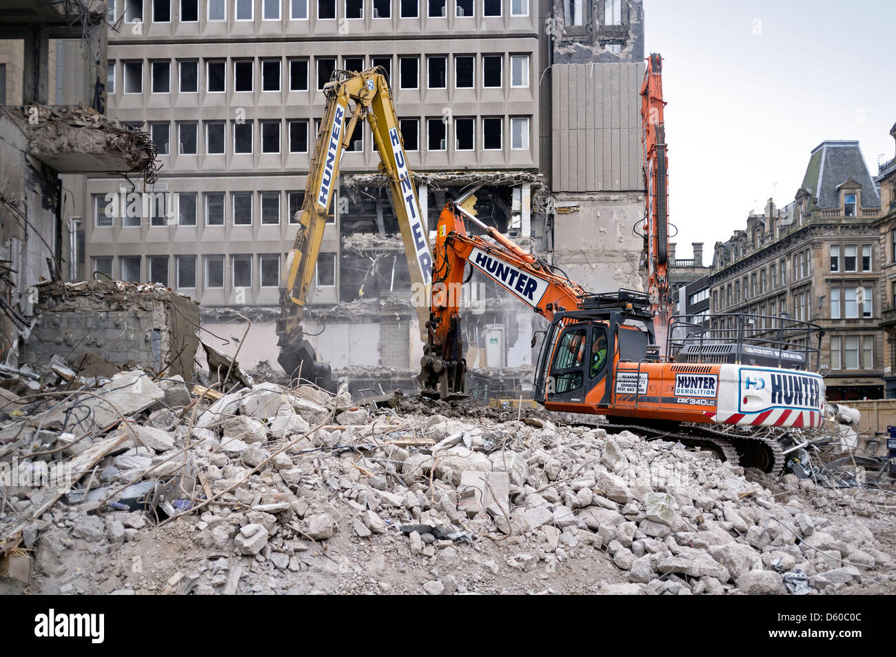 Contractor demolishing an old office block in the centre of Glasgow ...