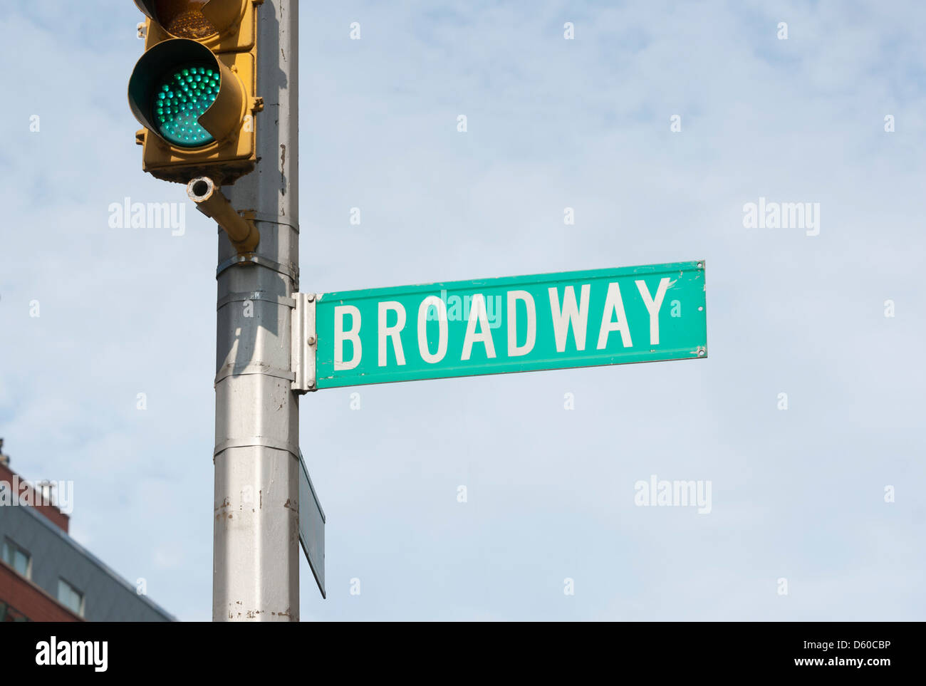 Broadway, street sign with green traffic light in New York City, New ...