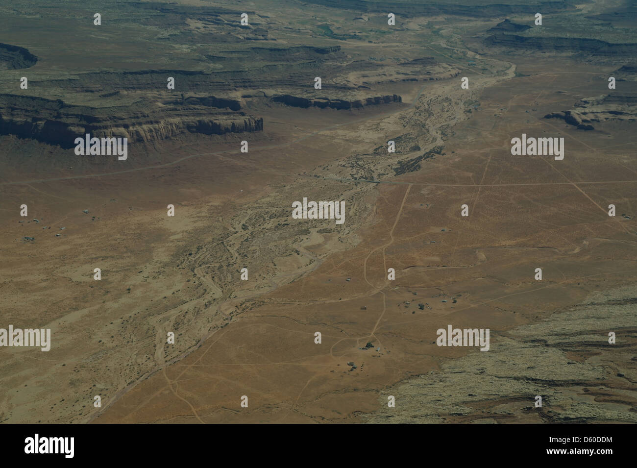 Aerial view, looking south to Oljato Mesa, dry braided stream channel ...