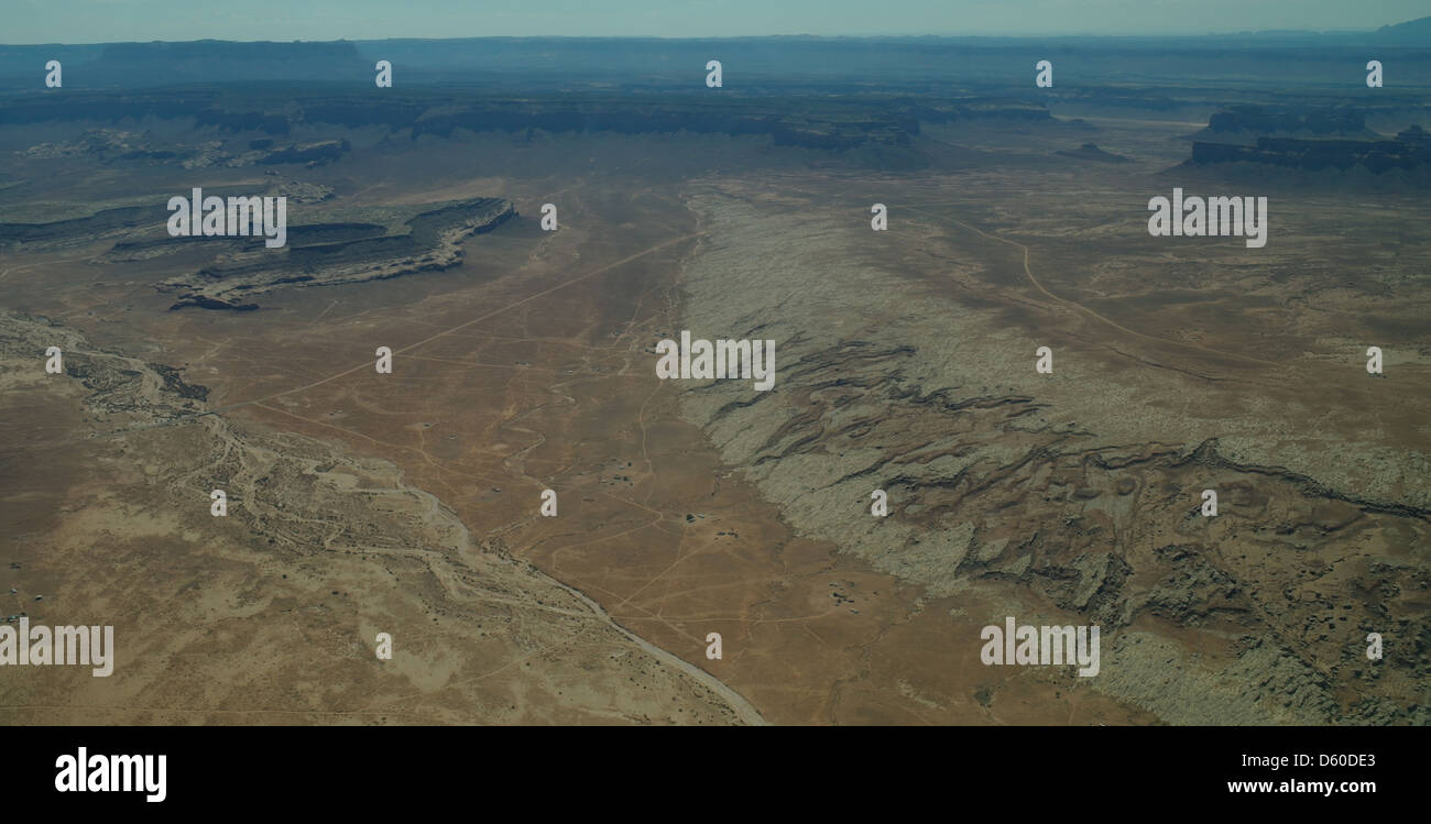Aerial arid valley view, to Oljato Mesa, dry braided stream channel ...