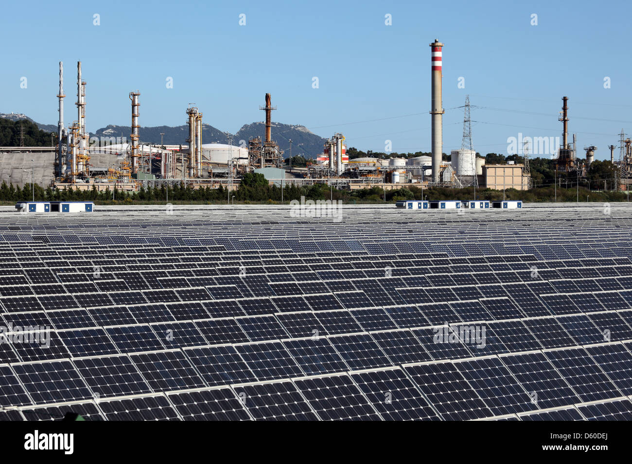 Solar power station with a oil refinery in the background Stock Photo ...