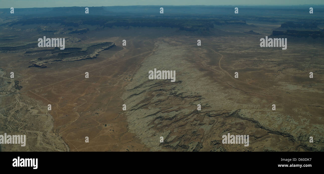 Aerial arid landscape view, to Oljato Mesa, dry braided stream channel ...