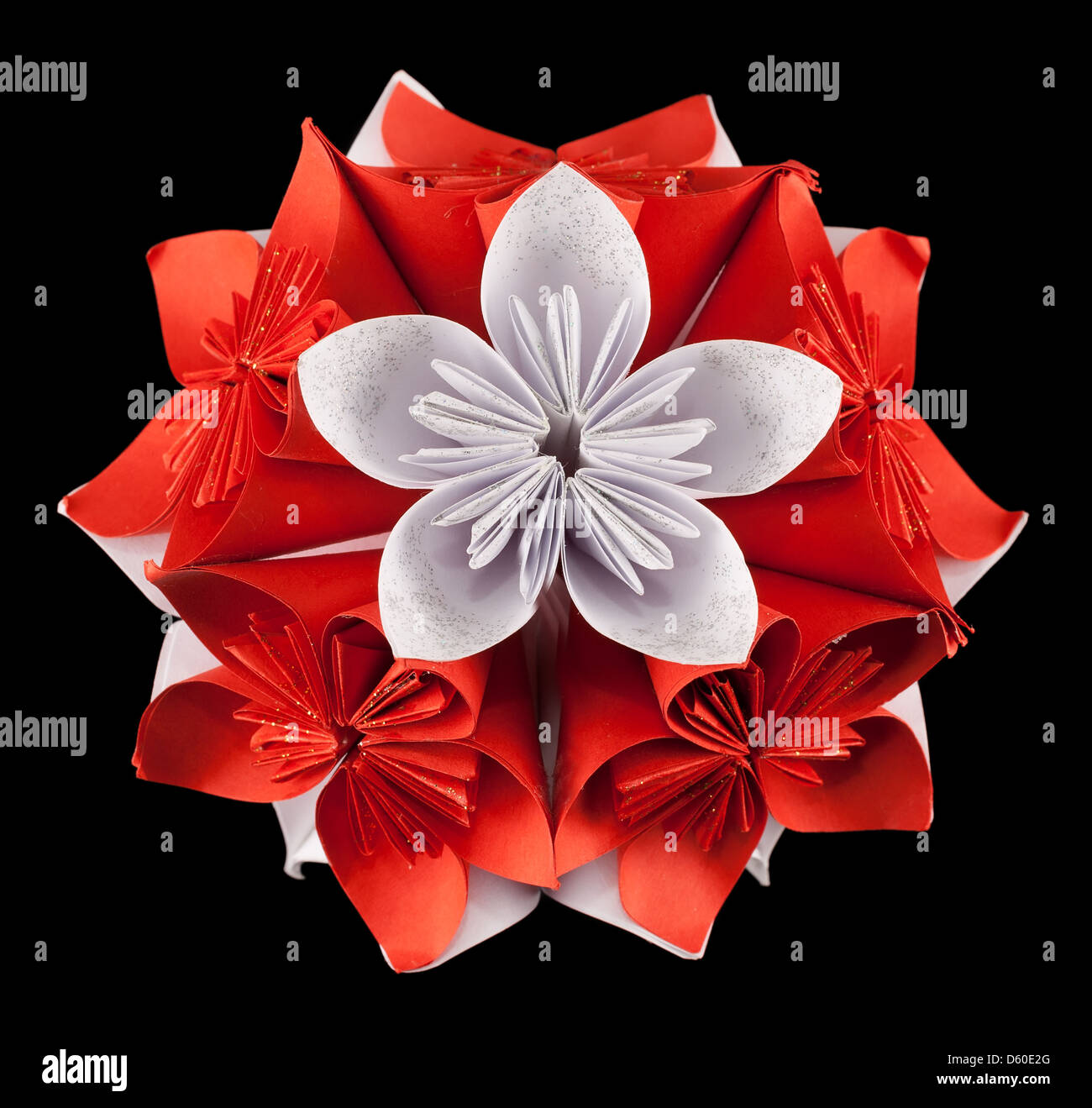 Red and white paper origami kusudama isolated on black Stock Photo - Alamy