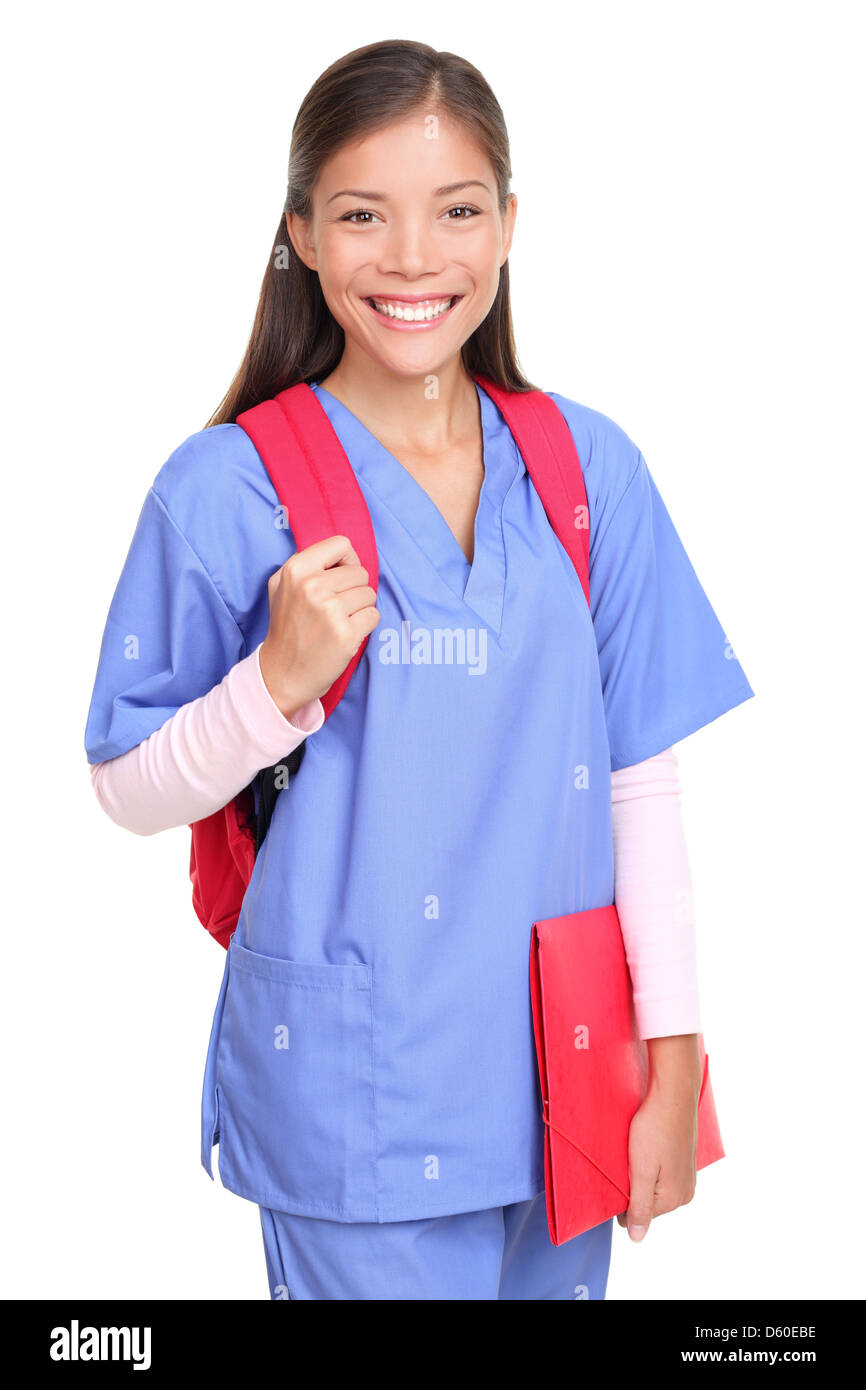 Portrait of female medical student smiling with backpack and scrubs ...