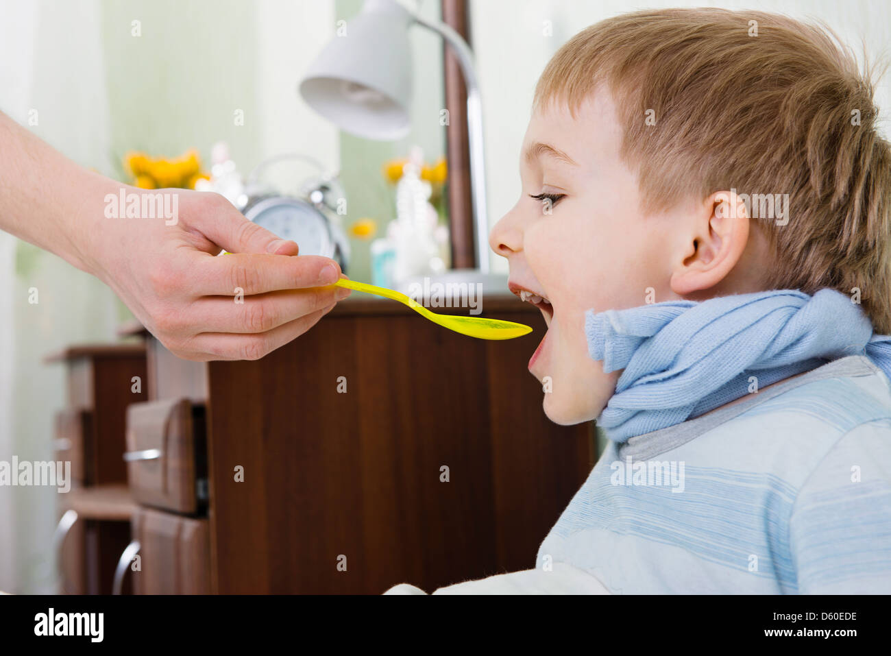 Boy taking medicine hi-res stock photography and images - Alamy