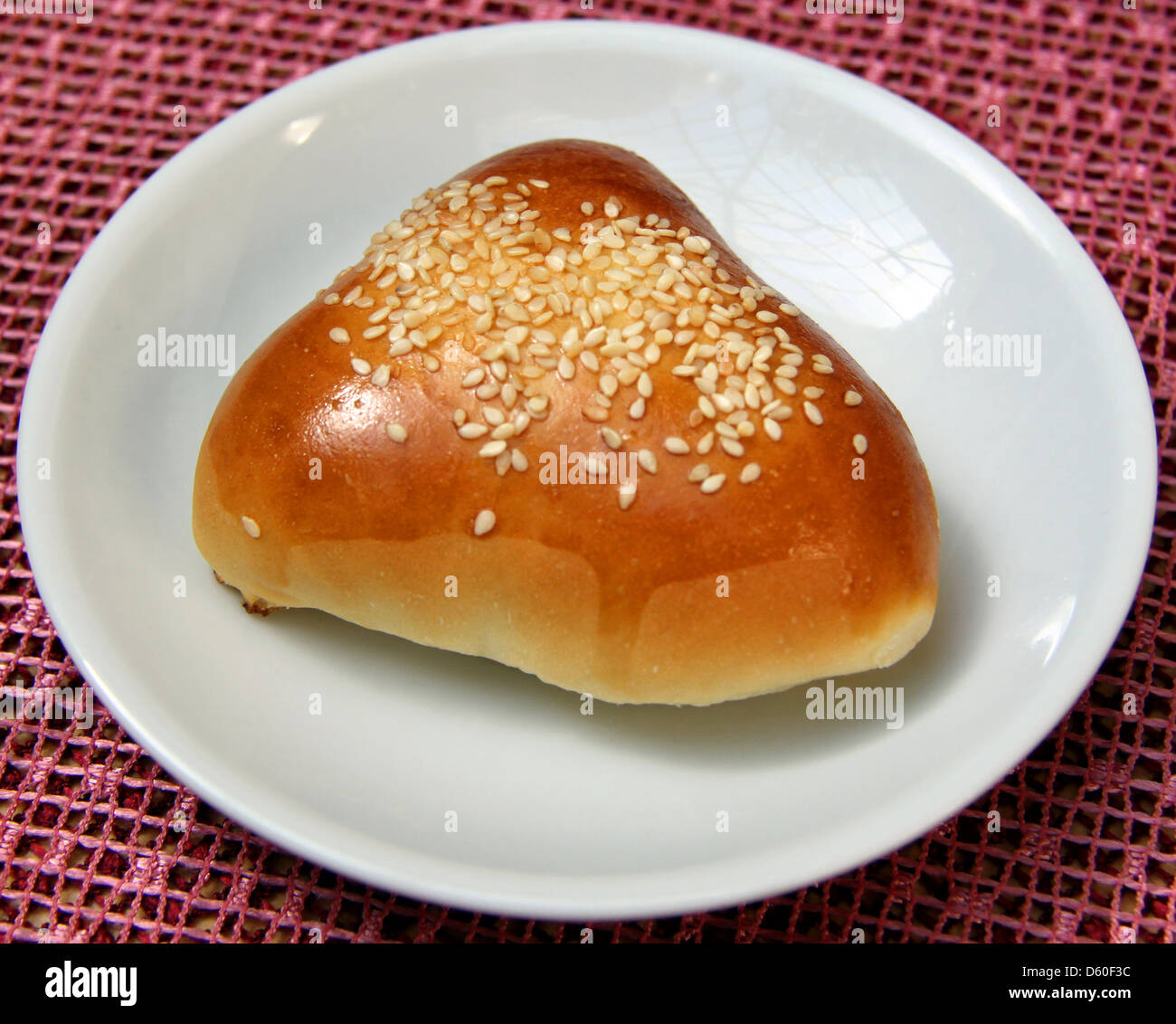 Bun lying on a the plate Stock Photo - Alamy