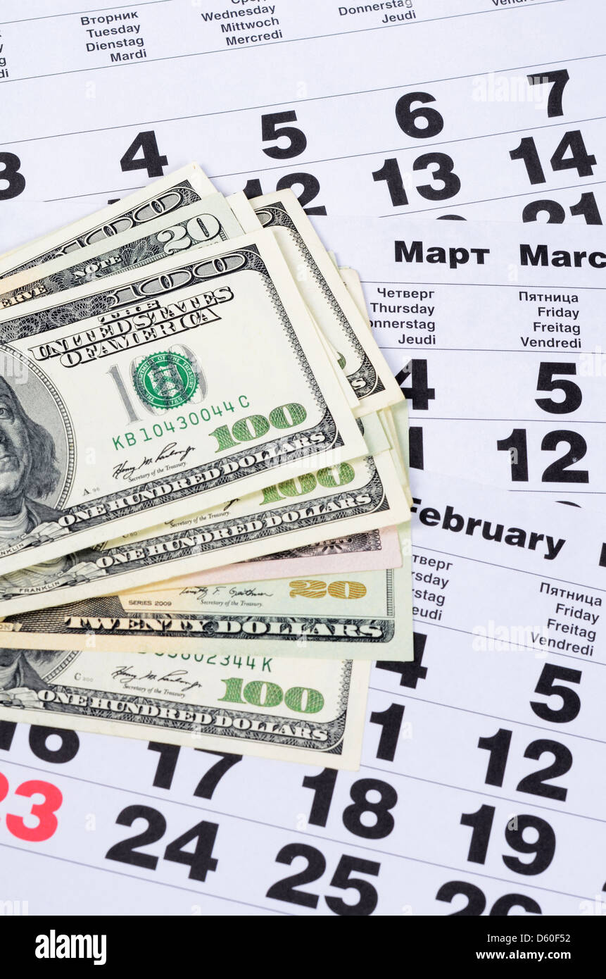 Banknotes of dollars on calendar sheets Stock Photo - Alamy