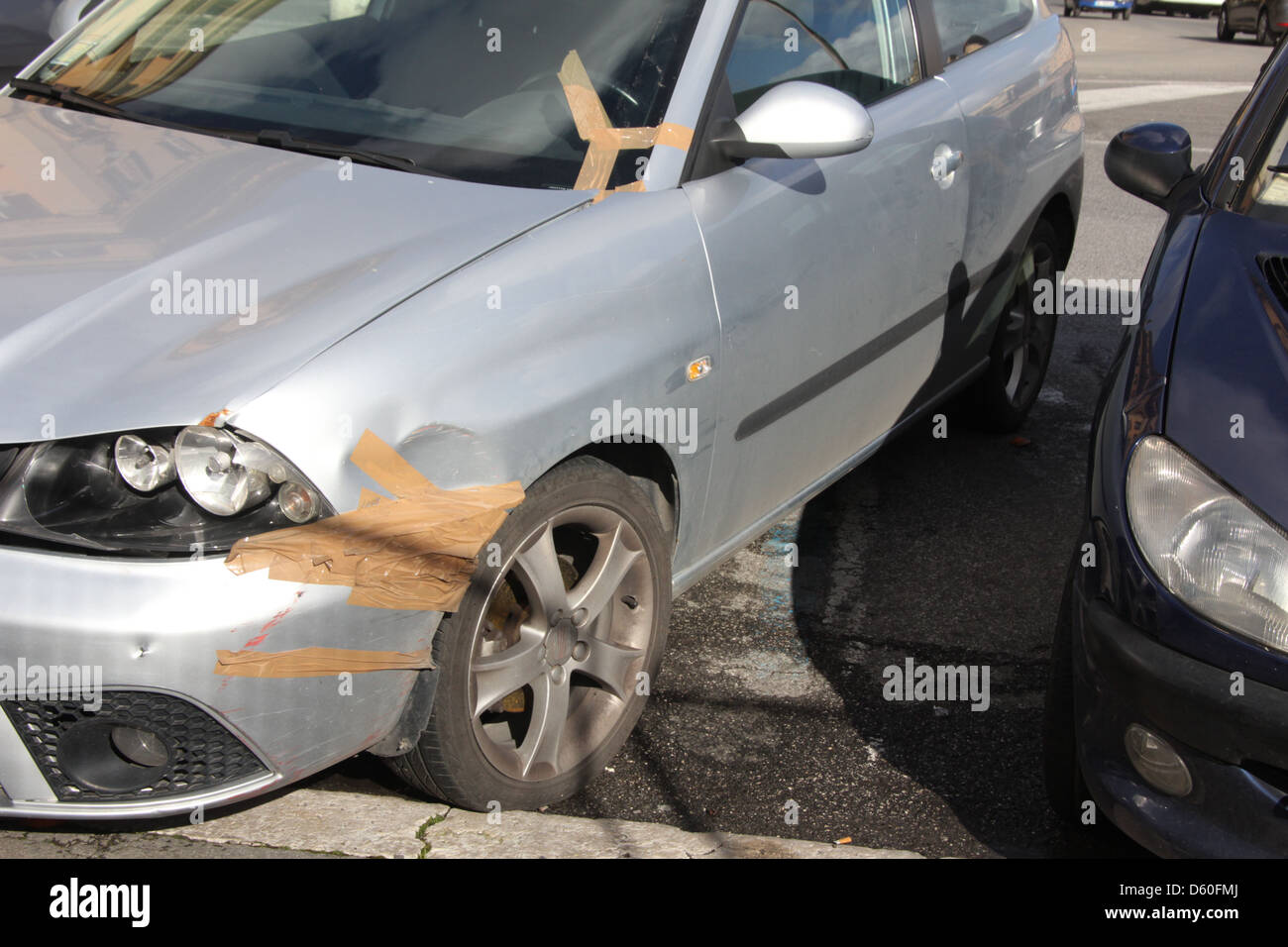 temporary repair for damaged car with adhesive tape Stock Photo - Alamy