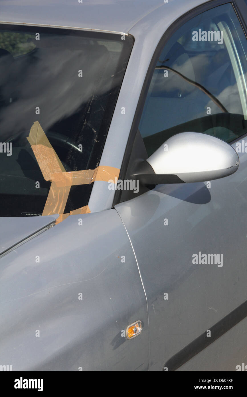 temporary repair for damaged car with adhesive tape Stock Photo - Alamy