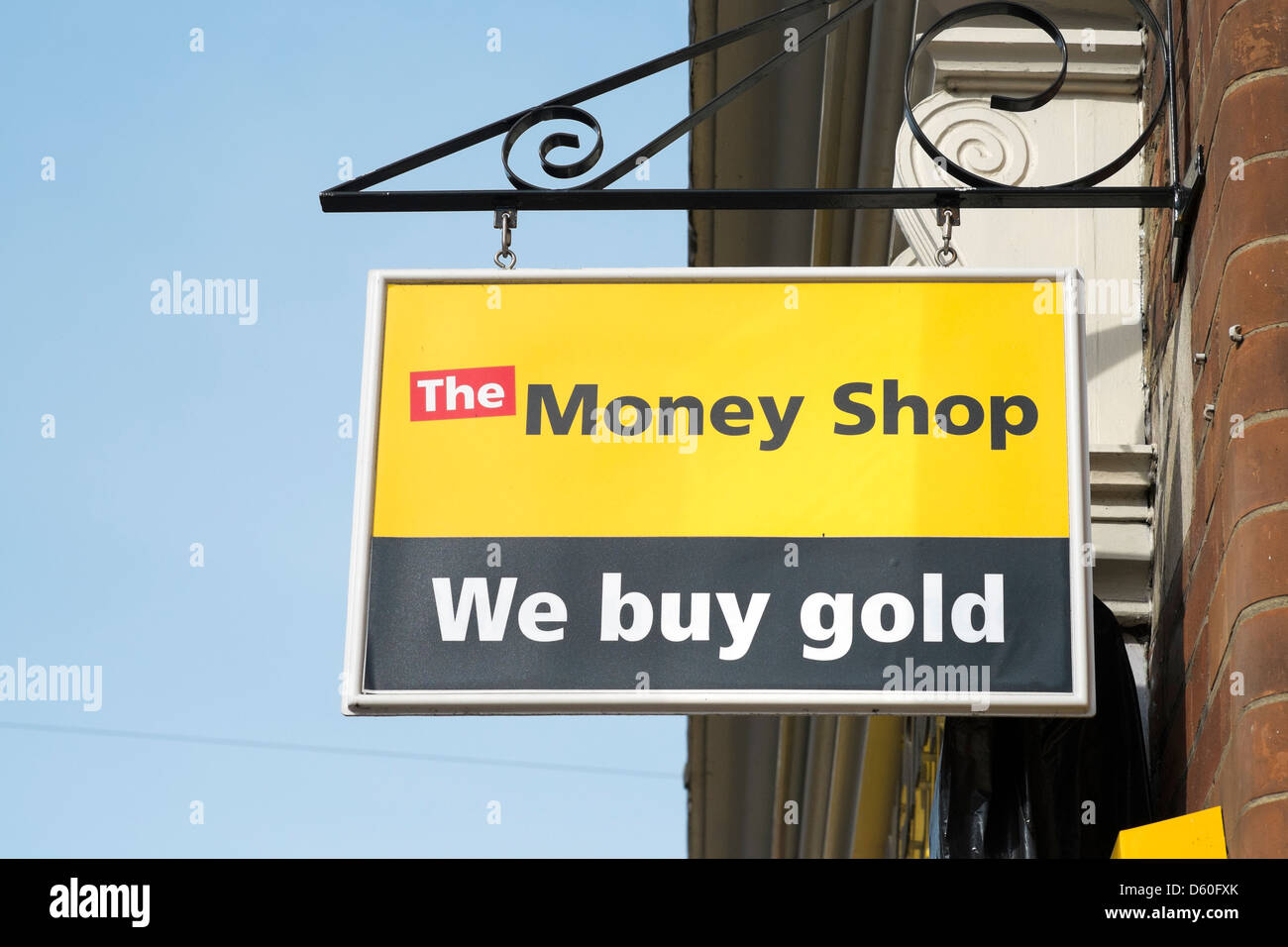 Looking up at Money Shop sign with name and logo Stock Photo - Alamy