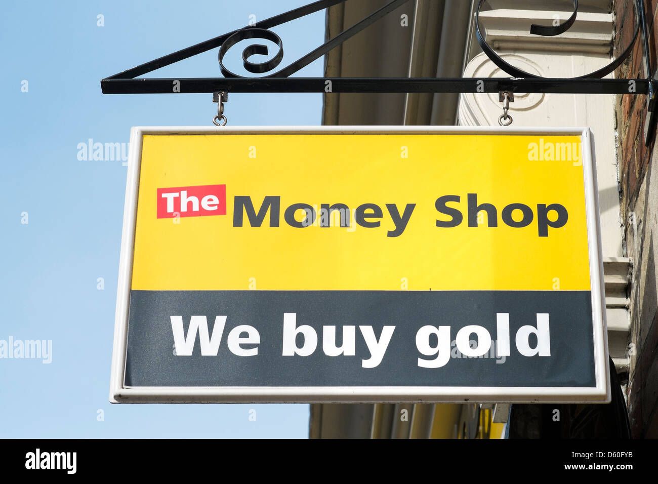 Looking up at Money Shop sign with name and logo Stock Photo - Alamy