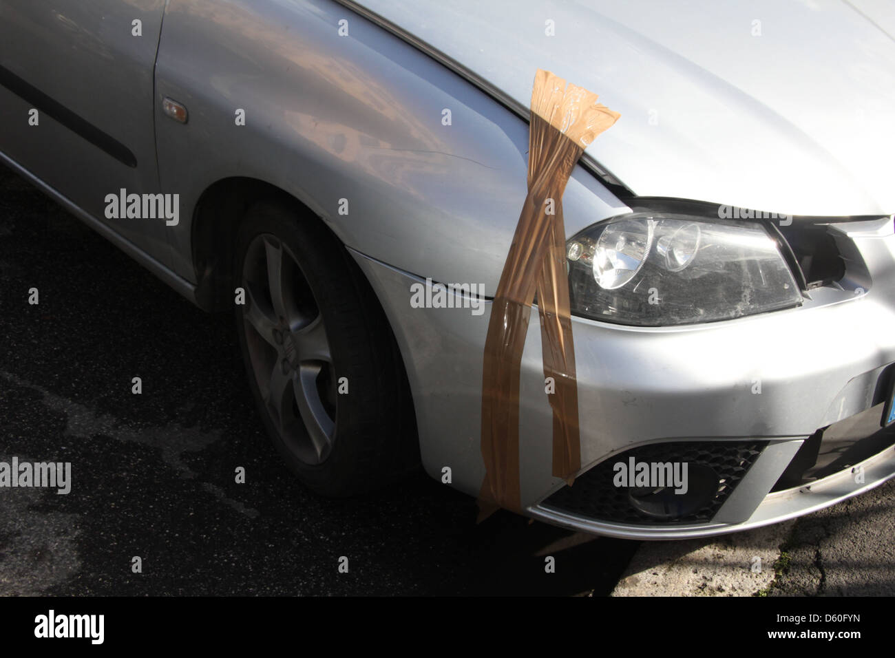 temporary repair for damaged car with adhesive tape Stock Photo - Alamy