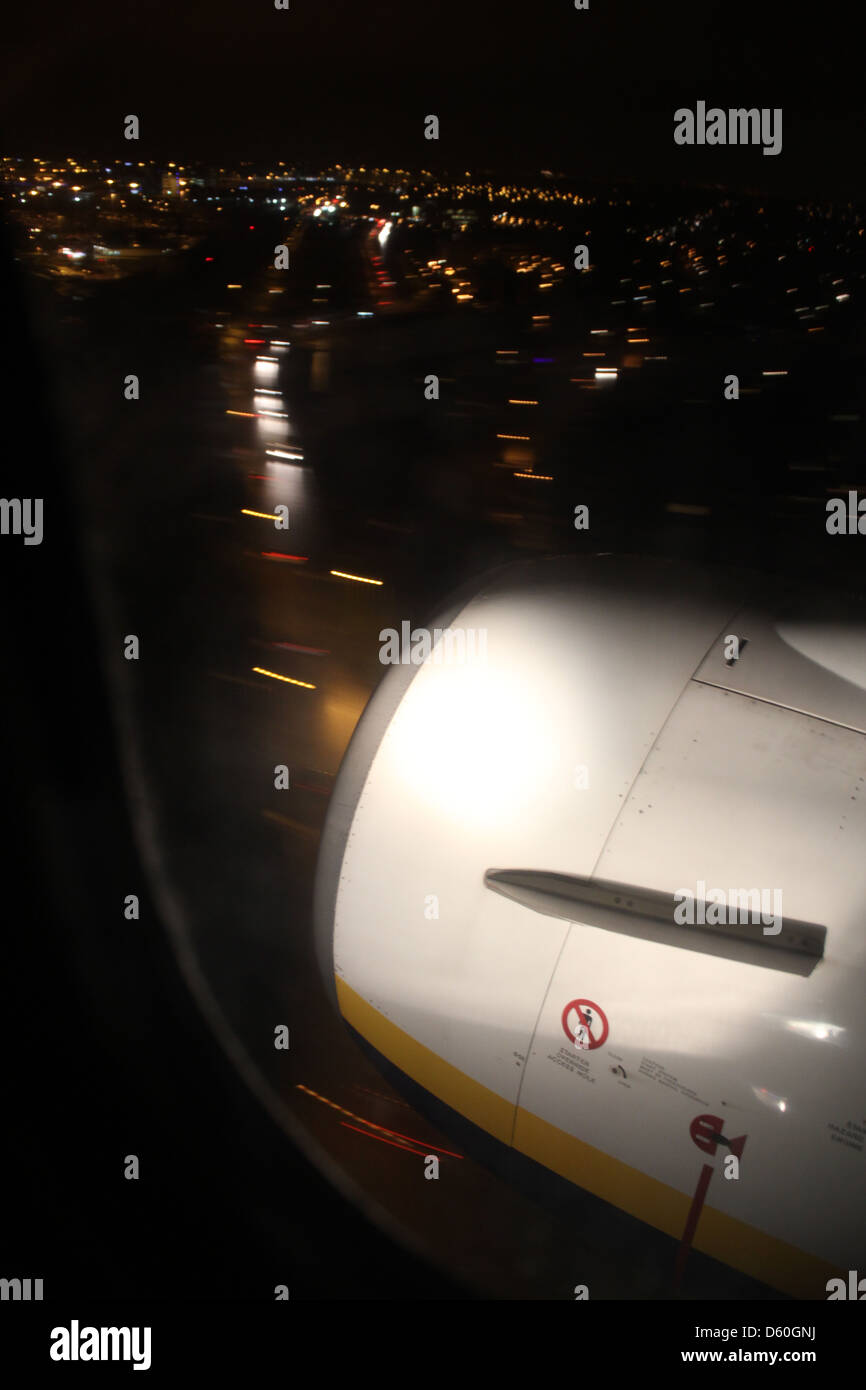 detail of plane engine coming in to land at airport at night Stock ...
