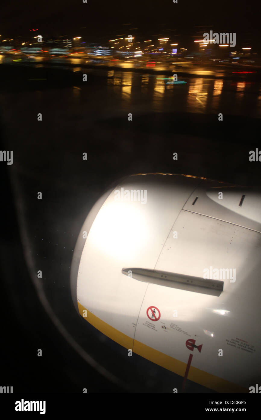 detail of plane engine coming in to land at airport at night Stock ...
