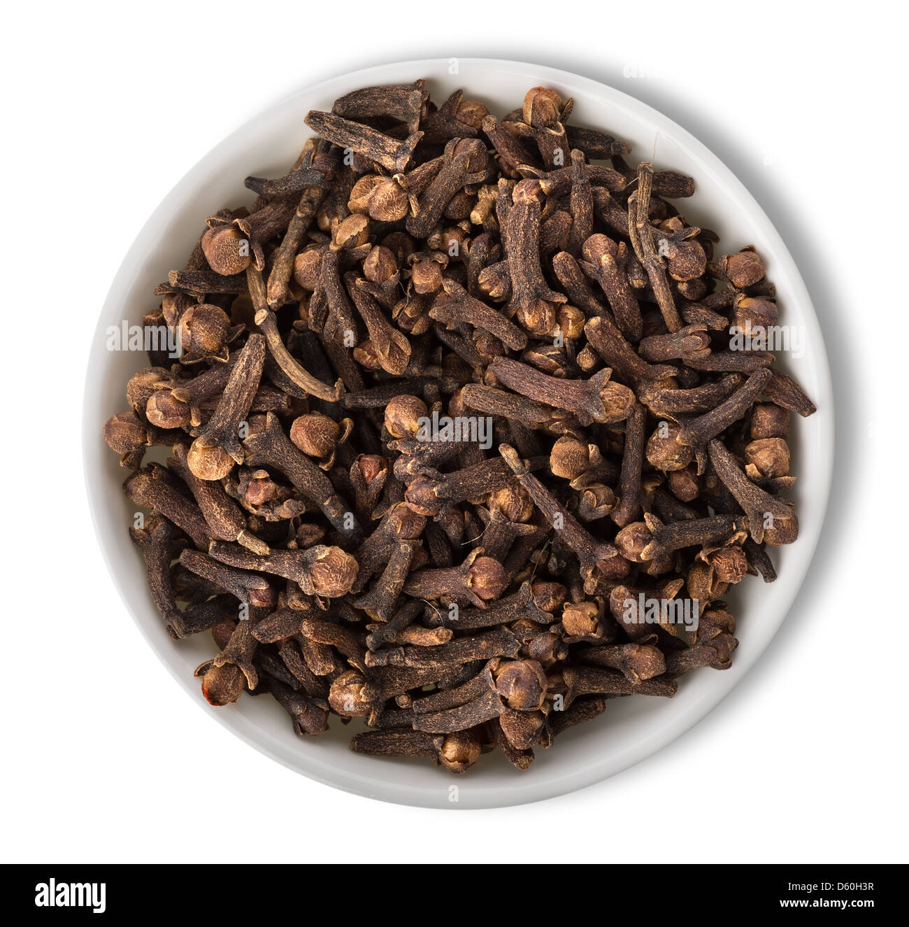 Clove in plate isolated on white background Stock Photo - Alamy
