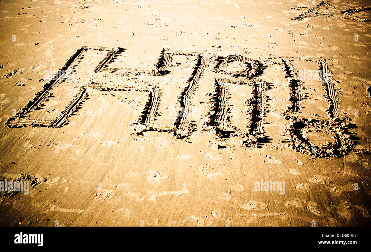 Hi! written in sand on beach Stock Photo - Alamy