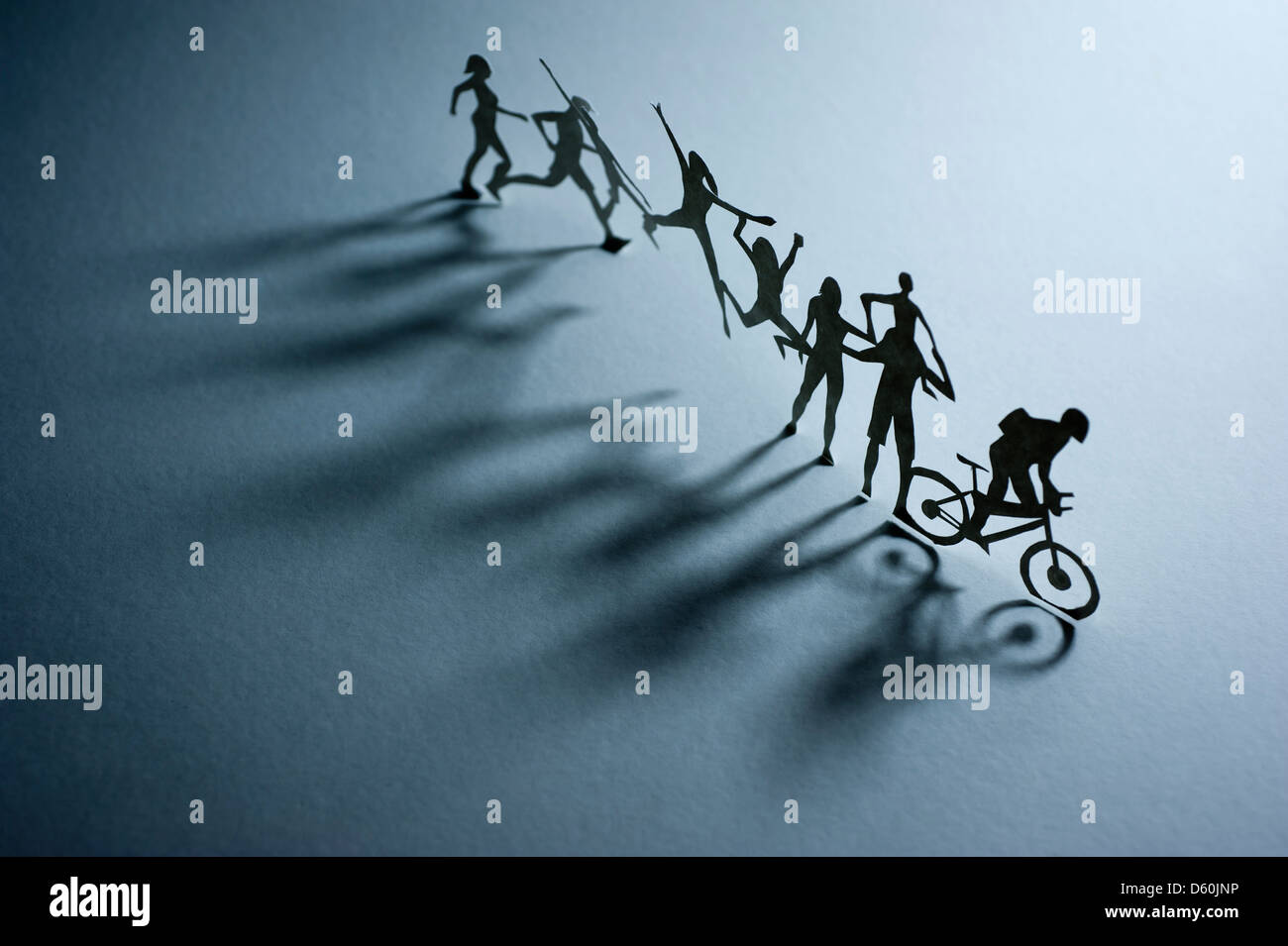 A Line of Paper People - Macro photography Stock Photo - Alamy