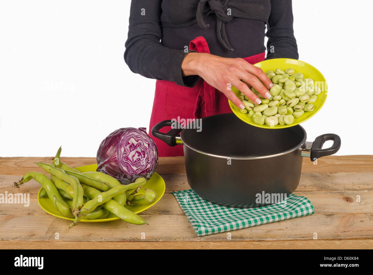 Female hands cooking with vegetable in a steel pot Stock Photo - Alamy