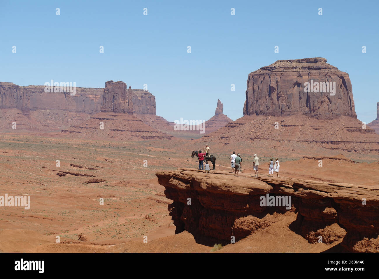 Blue sky view man sitting cowboy horse, tourists John Ford's Point, to ...