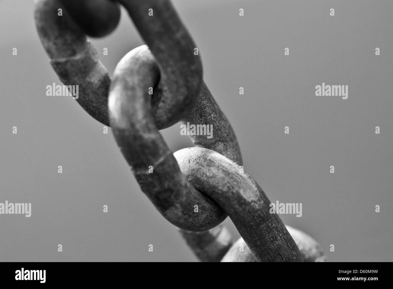Chain under tension on a Grey background black and white Stock Photo ...