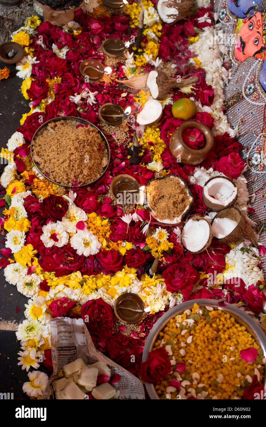 Offerings of food and flowers bedeck a shrine in Udaipur, Rajasthan ...