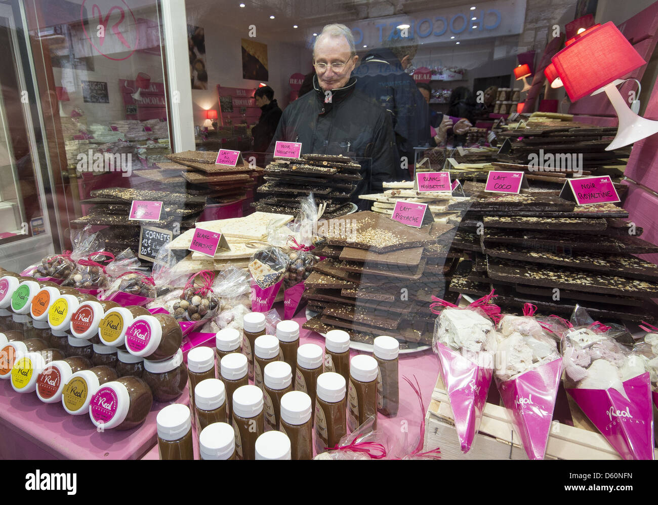 Man drooling over the chocolate confectionary displayed in shop window ...
