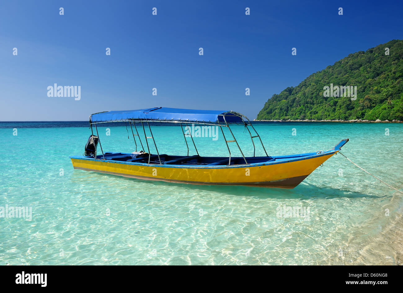Beautiful beach with motor boat Stock Photo - Alamy