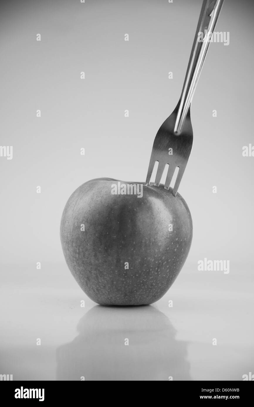 The Apple Gray on the white Background,The Gray apple There is a fork ...