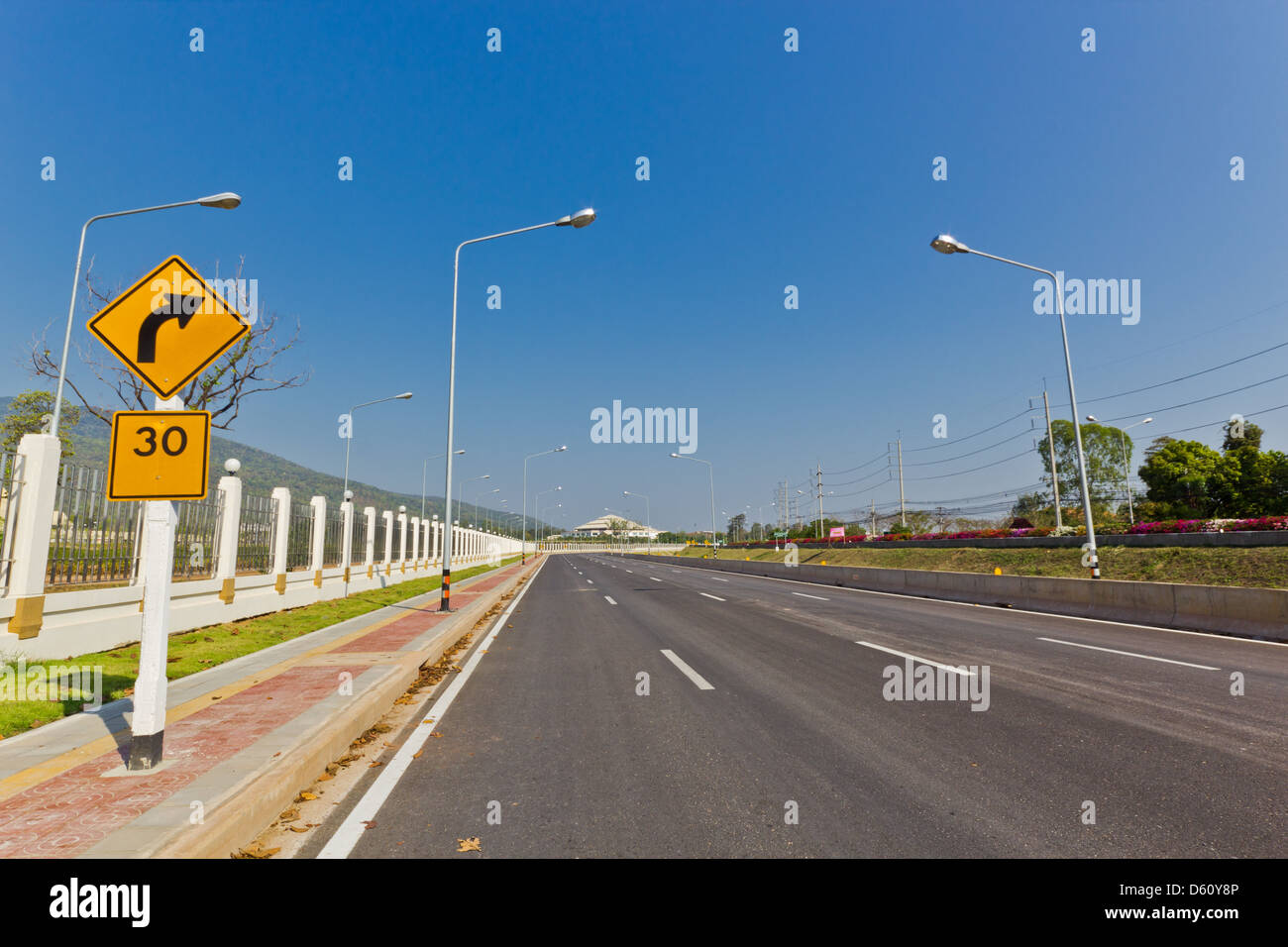 Distance Highway Road and Traffic Sign with Background of Blue Sky in a ...