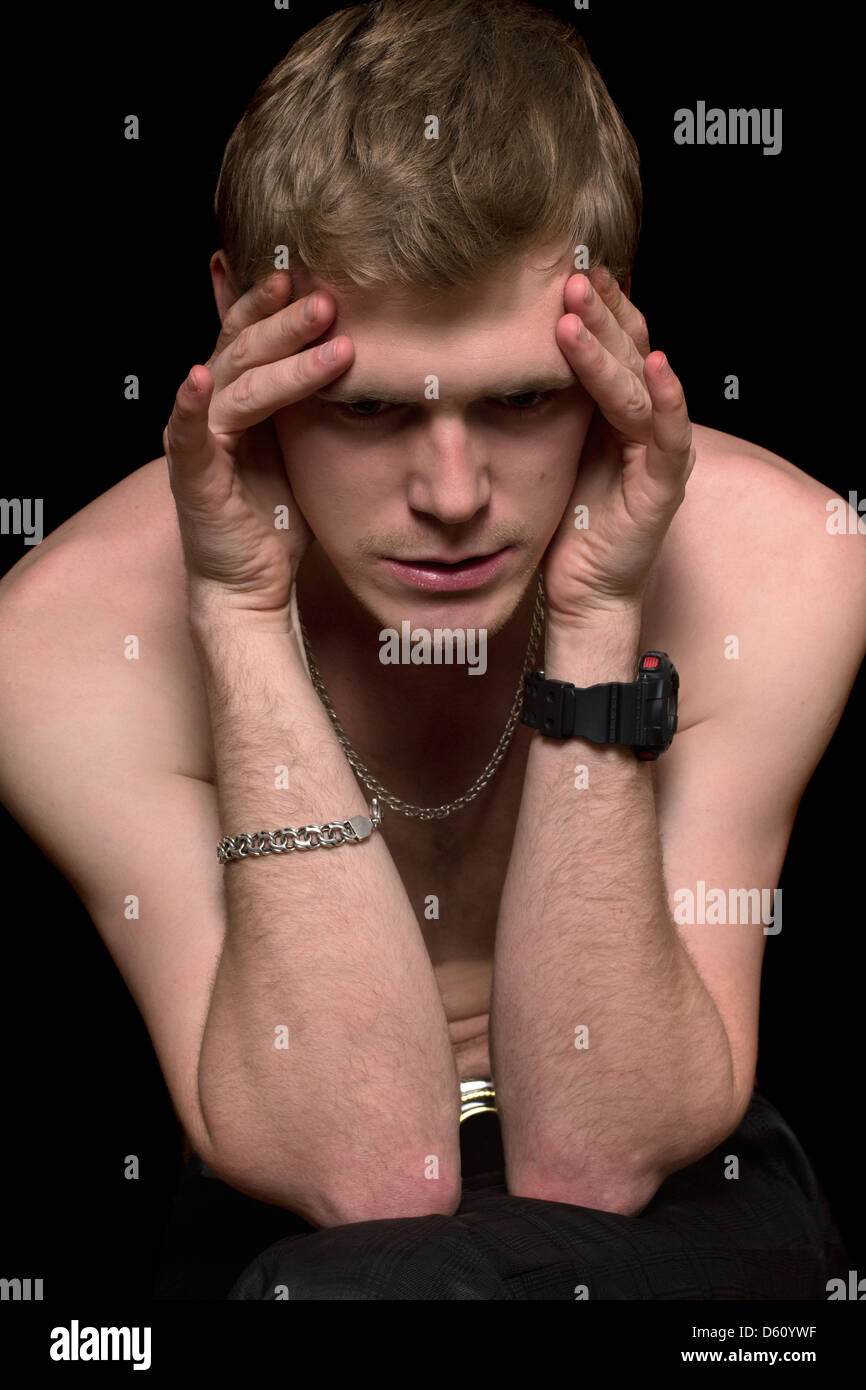 Portrait of stressed young man Stock Photo - Alamy