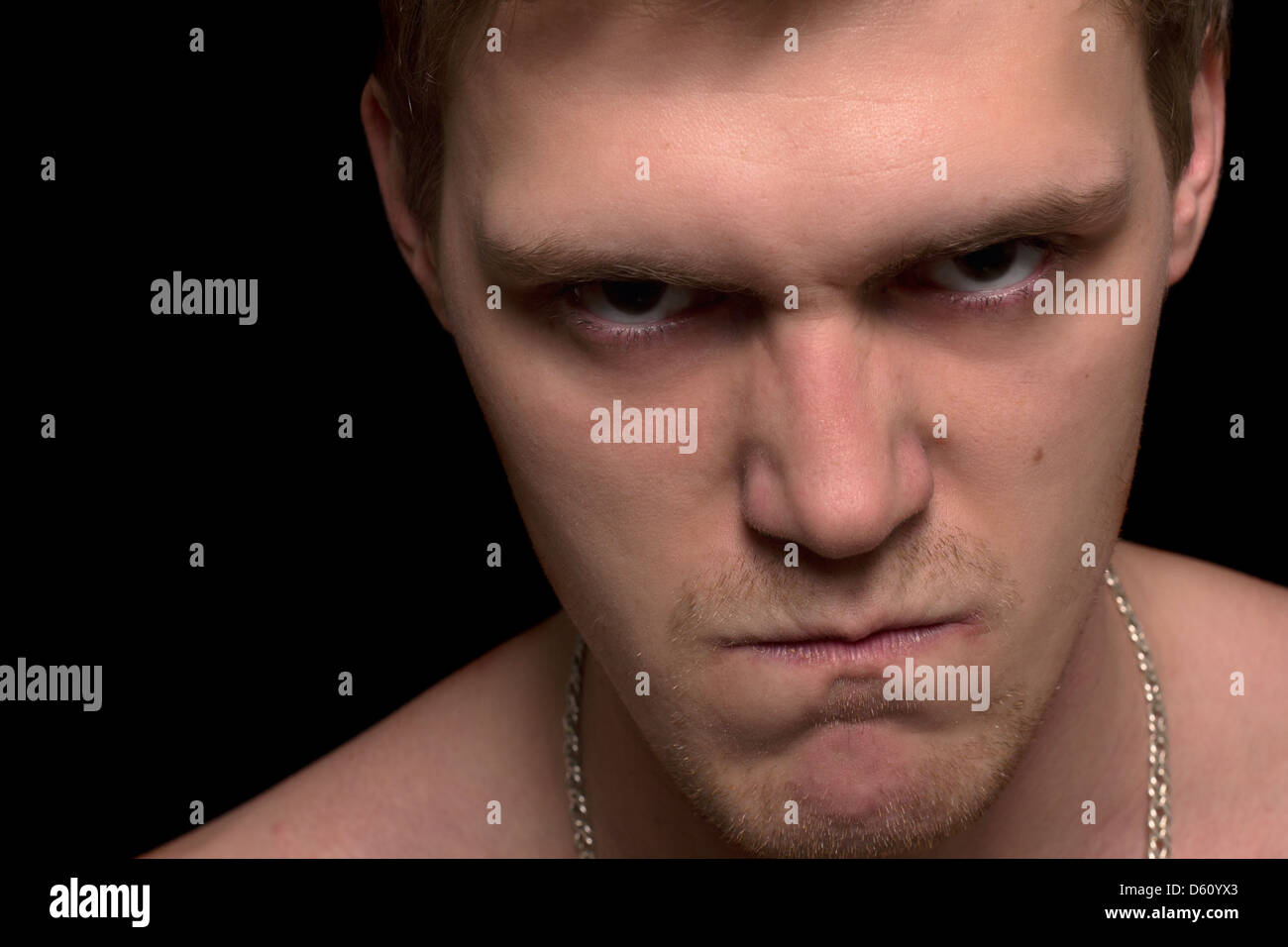 portrait of a furious young man Stock Photo - Alamy