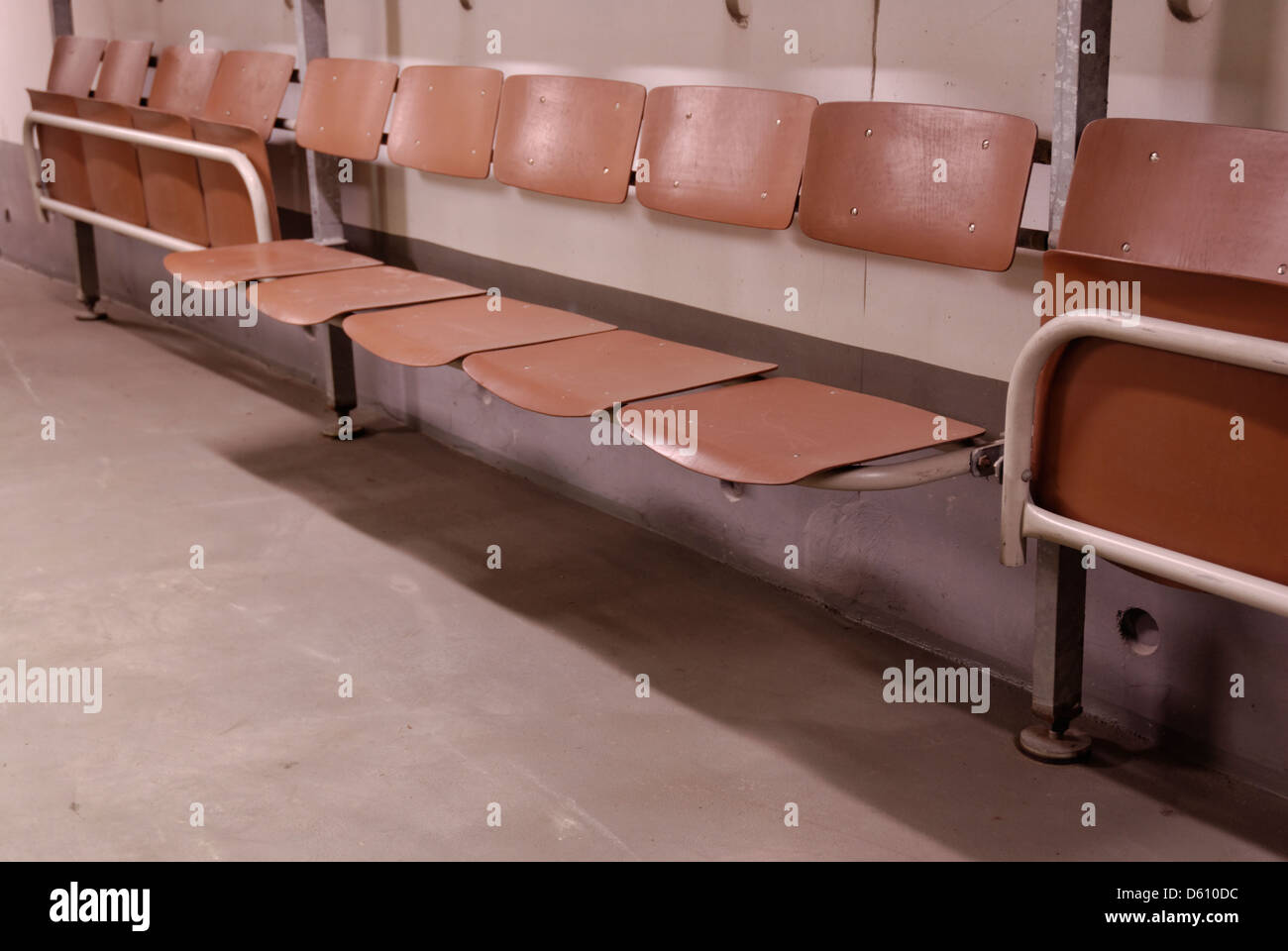 Folding chairs in a row Stock Photo - Alamy