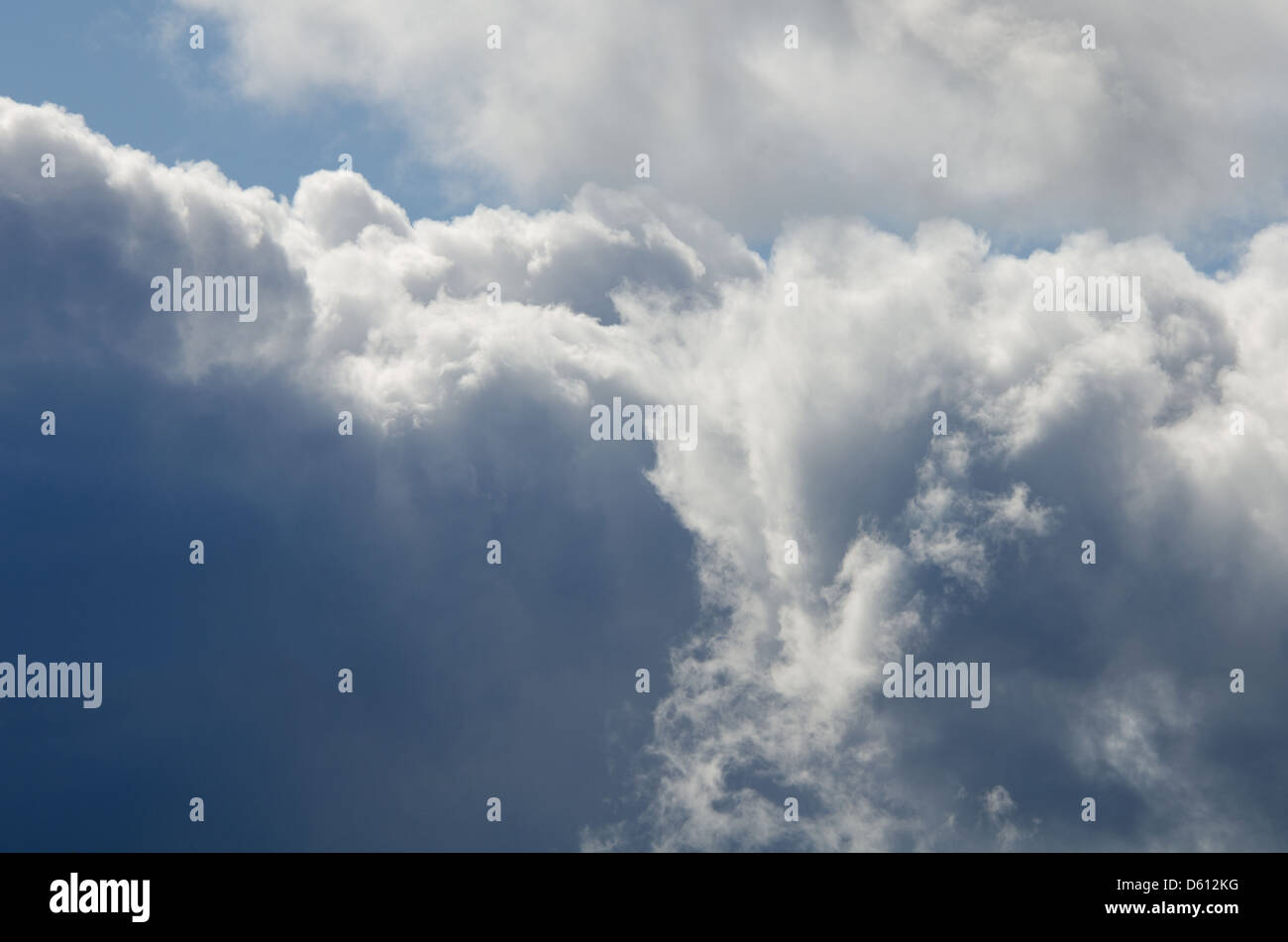 A glimpse of blue sky between gathering storm clouds Stock Photo - Alamy