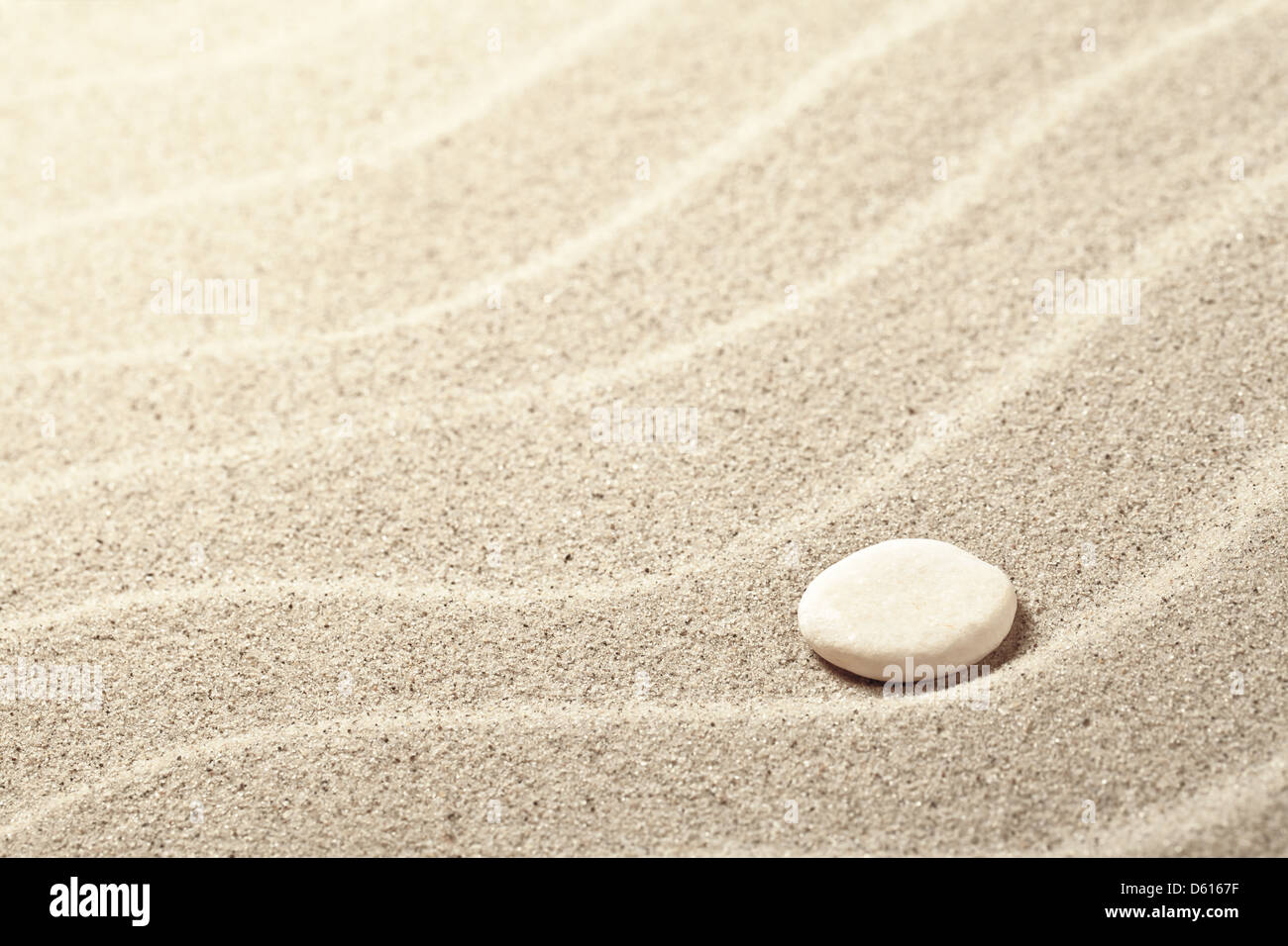Sand background with white stone. Sandy beach texture Stock Photo - Alamy