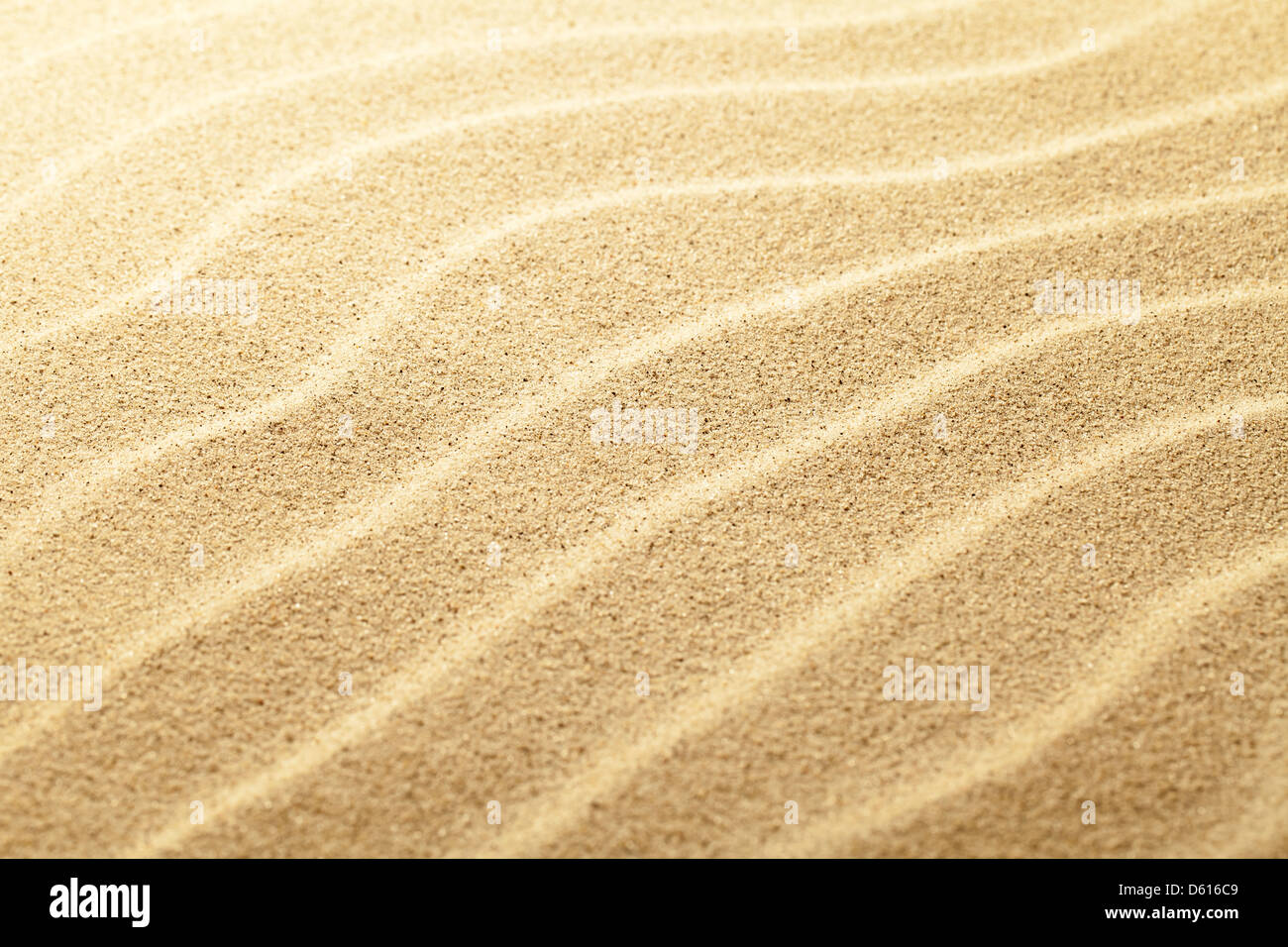 Sand background close up view. Focus on center Stock Photo - Alamy
