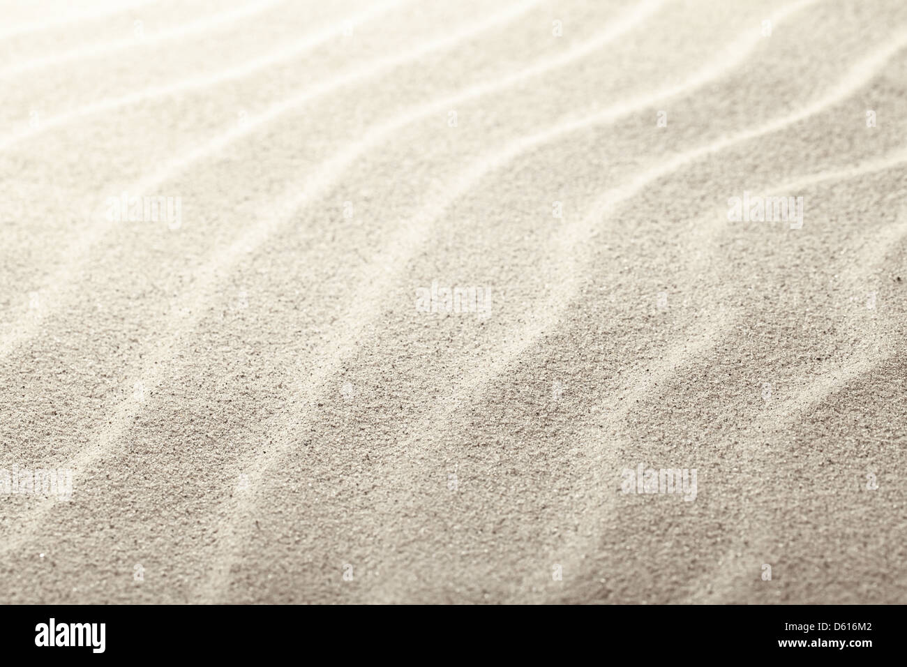 Beach sand as background, close up view Stock Photo - Alamy