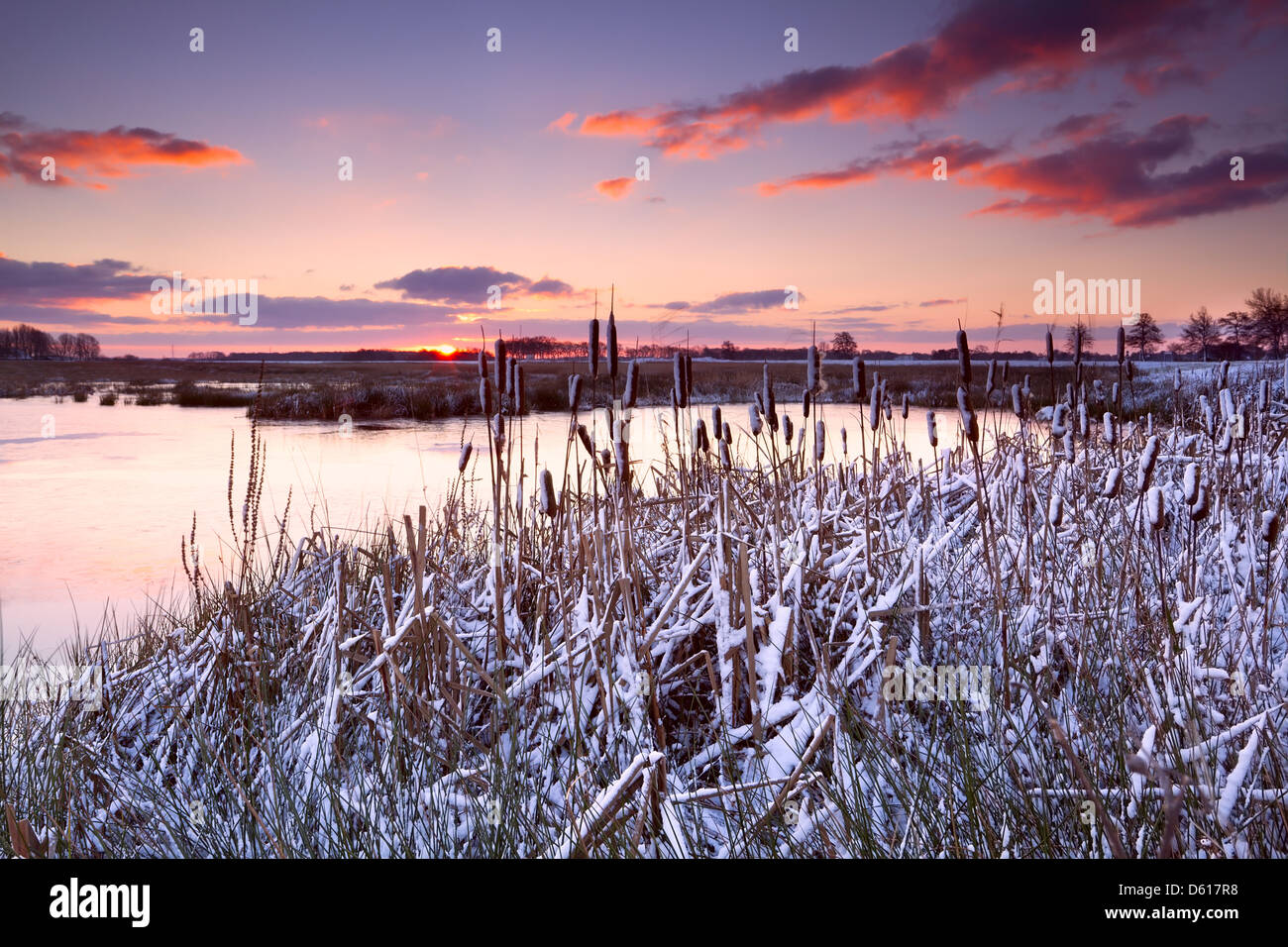 dramatic sunrise over frozen lake Stock Photo - Alamy